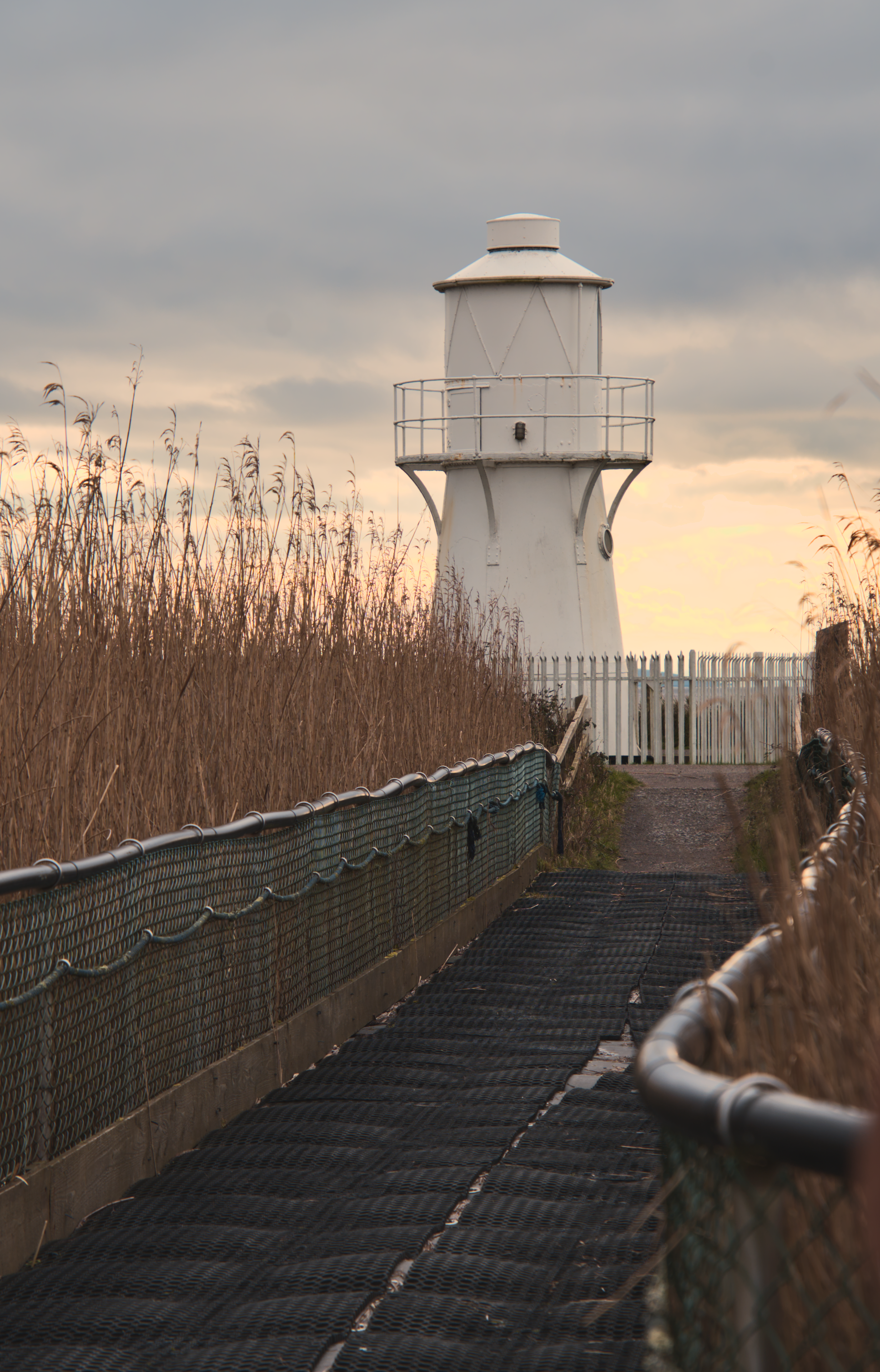 Secluded Lighthouse Path at Sunset in Wales · Free Stock Photo