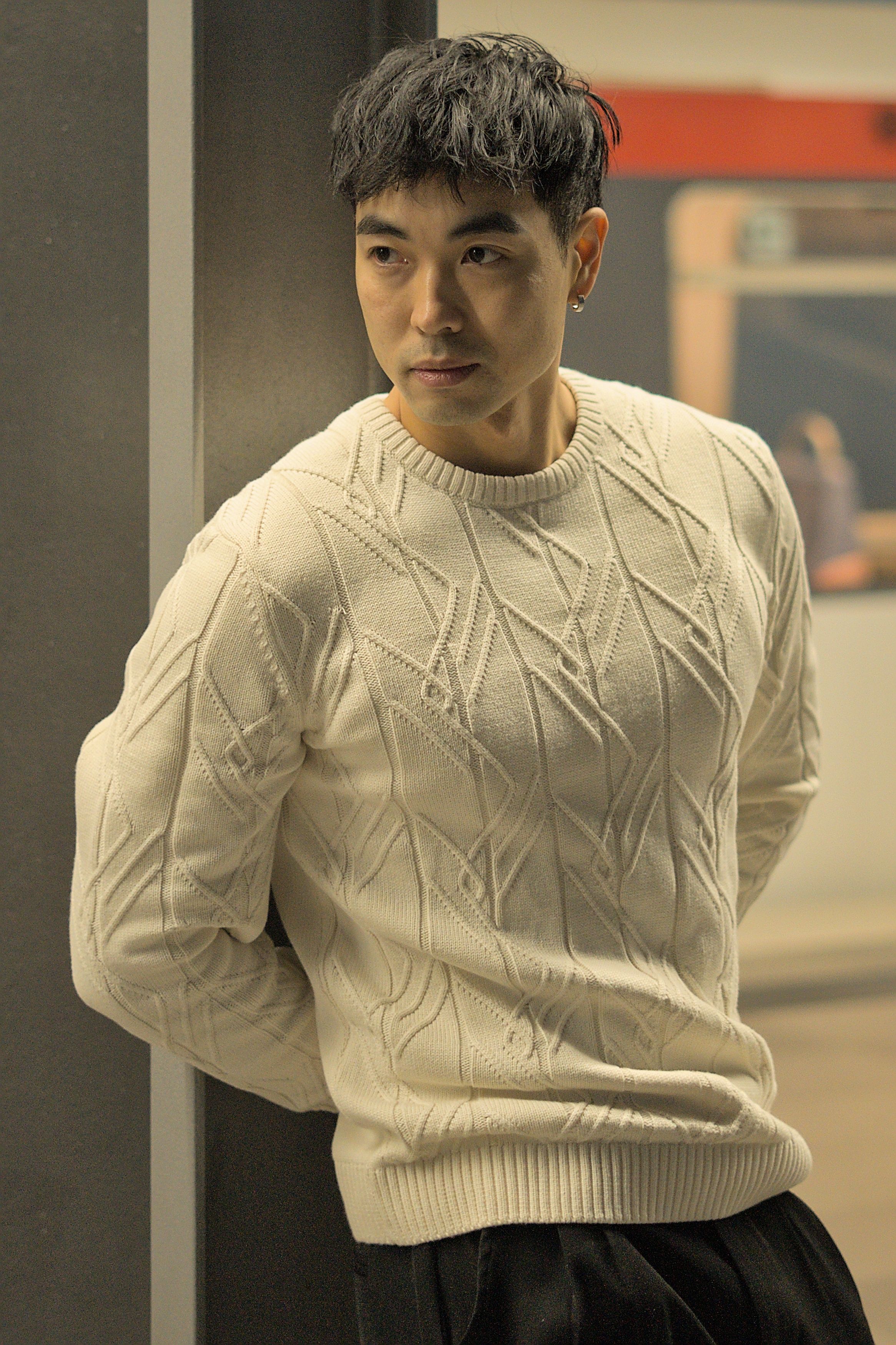 Stylish Man in Sweater at Urban Train Station · Free Stock Photo