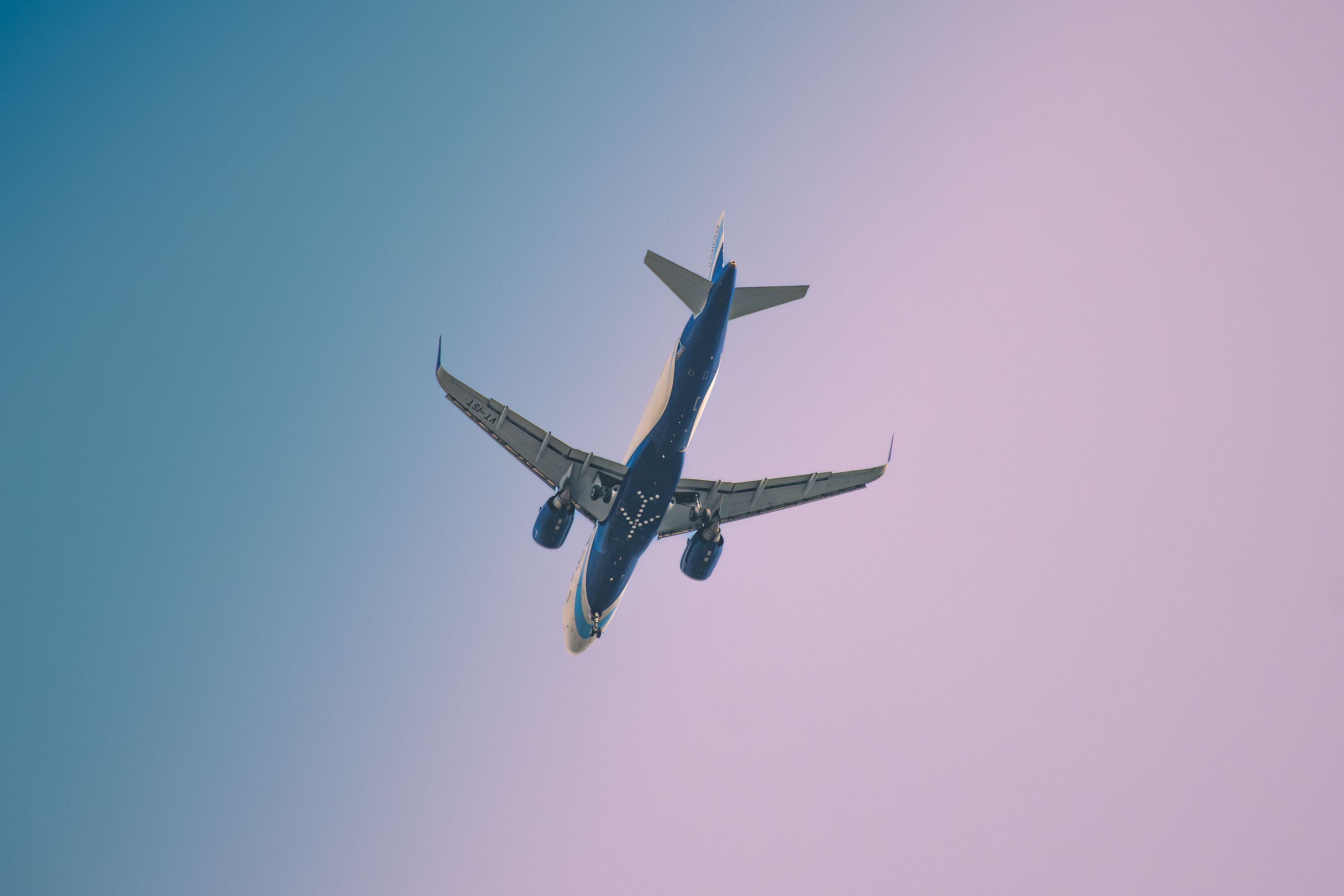 Airplane on Final Approach during Vibrant Sunset · Free Stock Photo