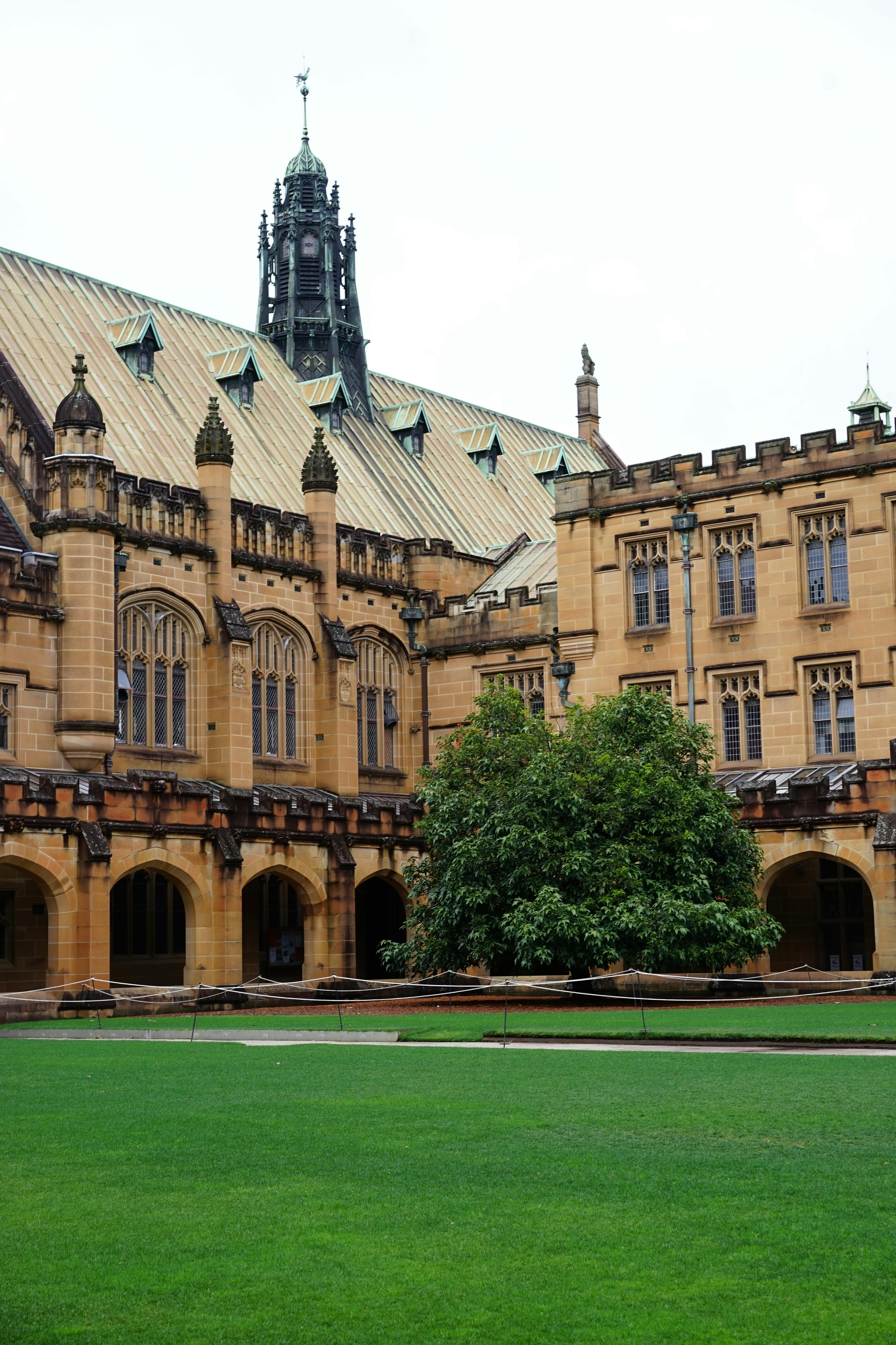 Historic University Building with Gothic Architecture · Free Stock Photo