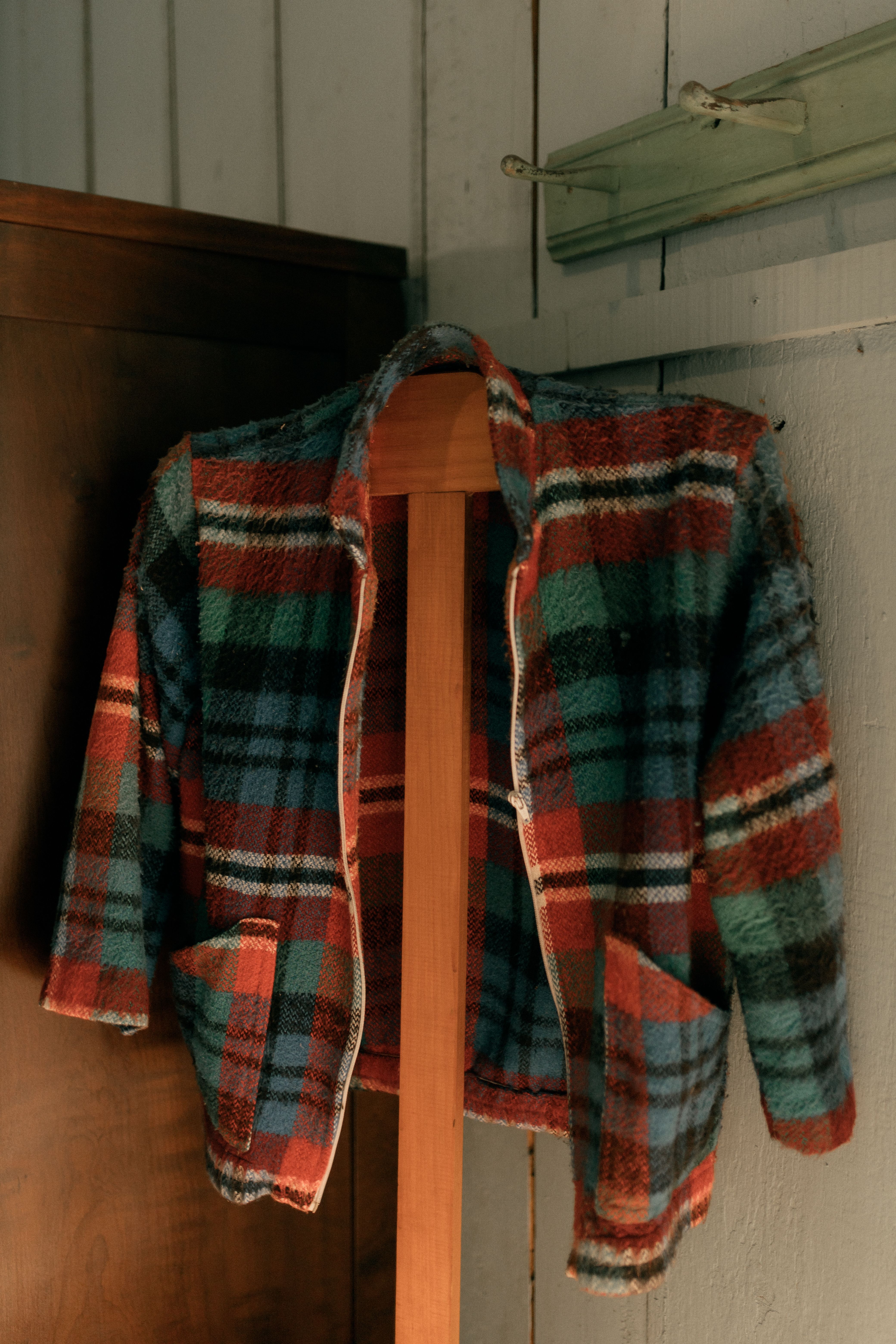 Vintage Plaid Jacket Hung on Wooden Stand · Free Stock Photo