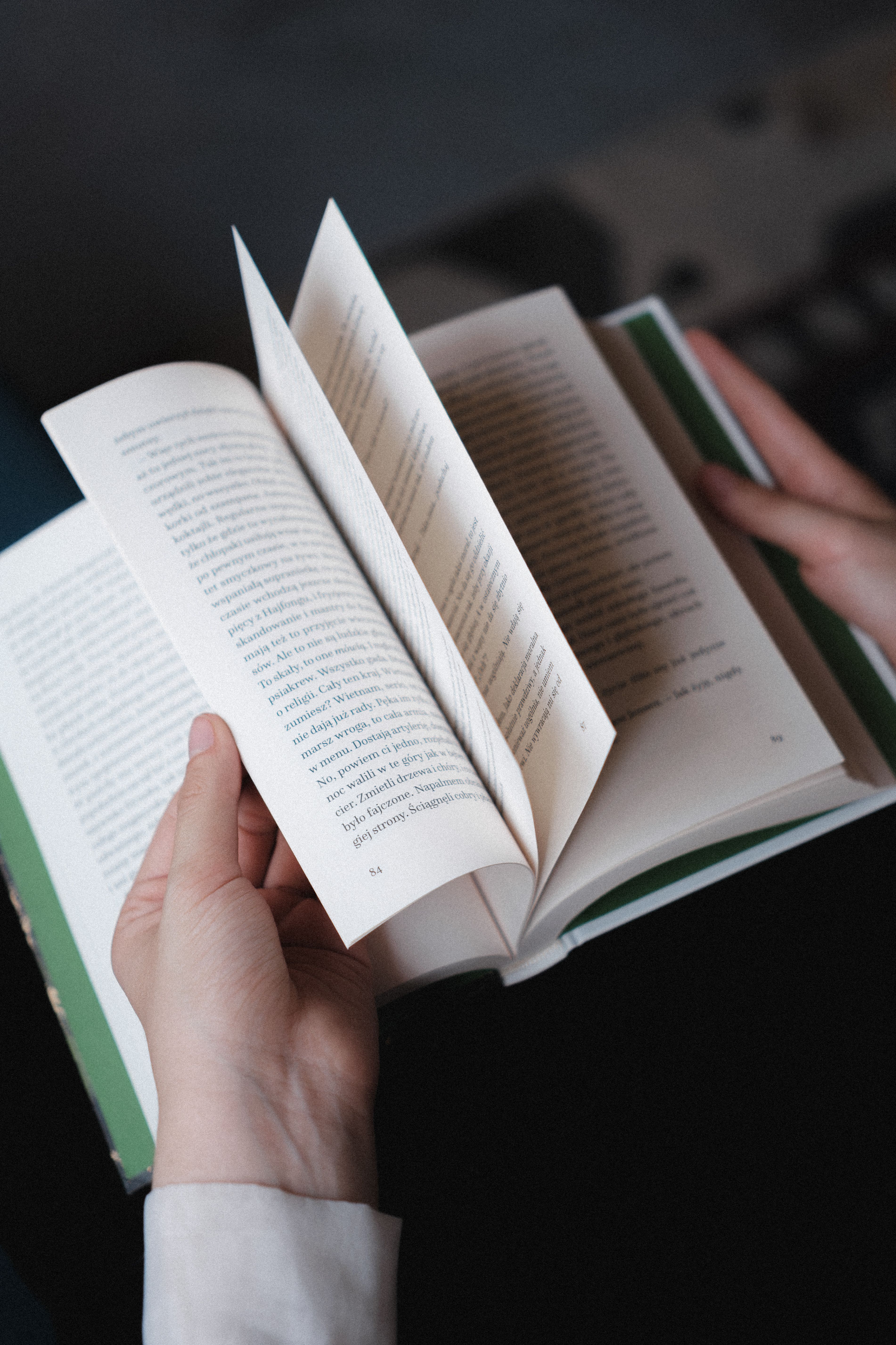 Hands Flipping Pages of an Open Book · Free Stock Photo