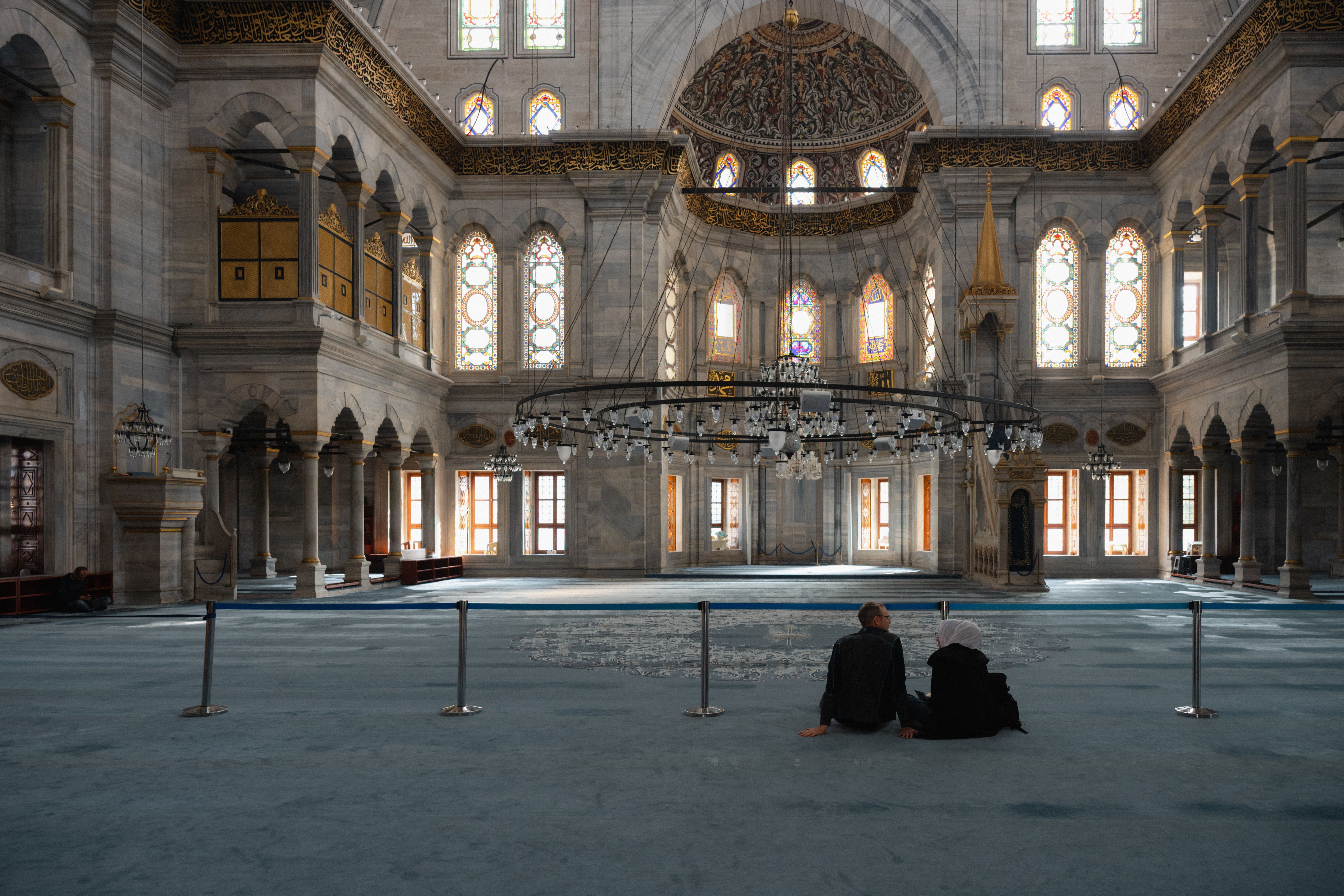 Interior View of a Historic Mosque with Visitors · Free Stock Photo