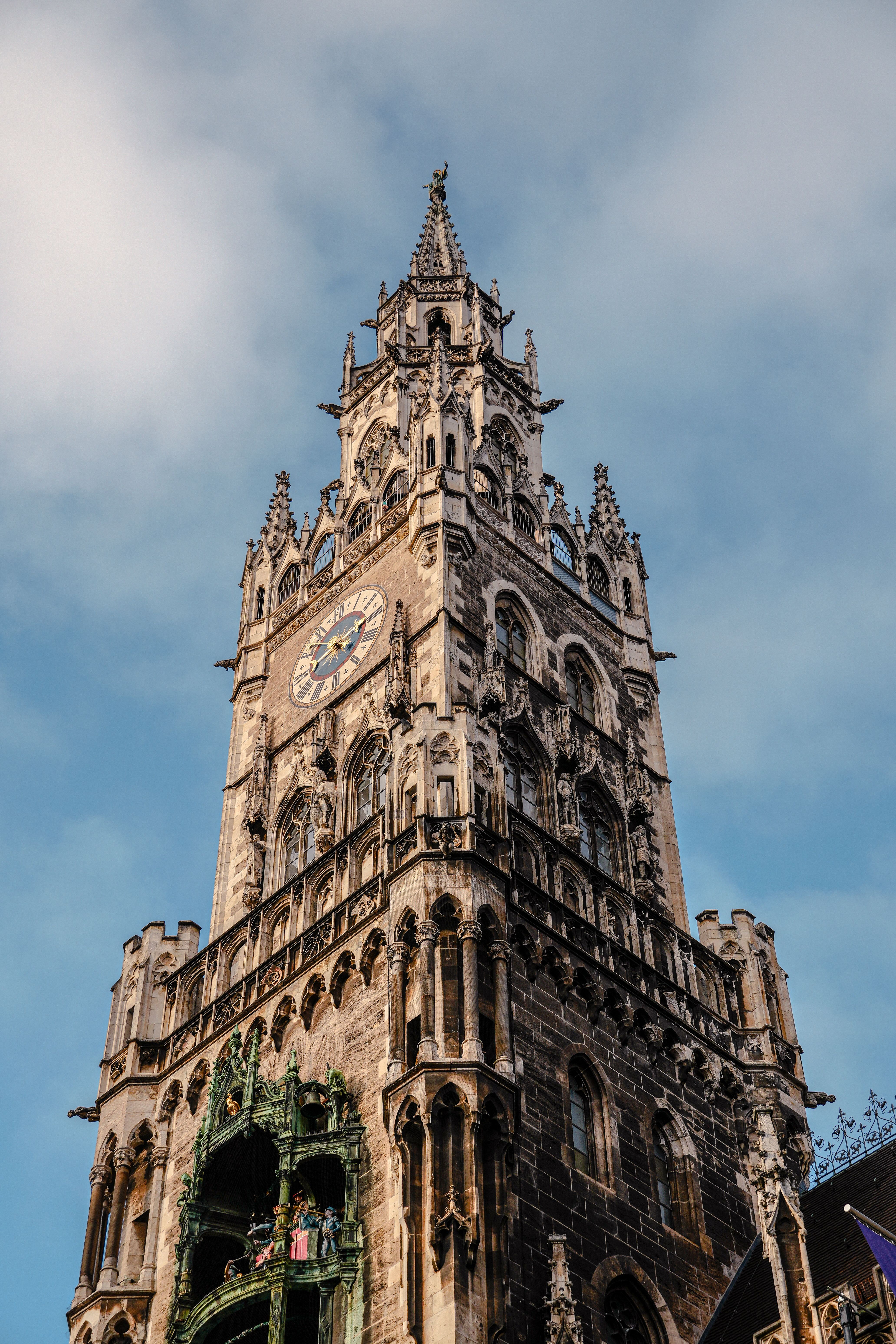 Ornate Gothic Clock Tower against Blue Sky · Free Stock Photo