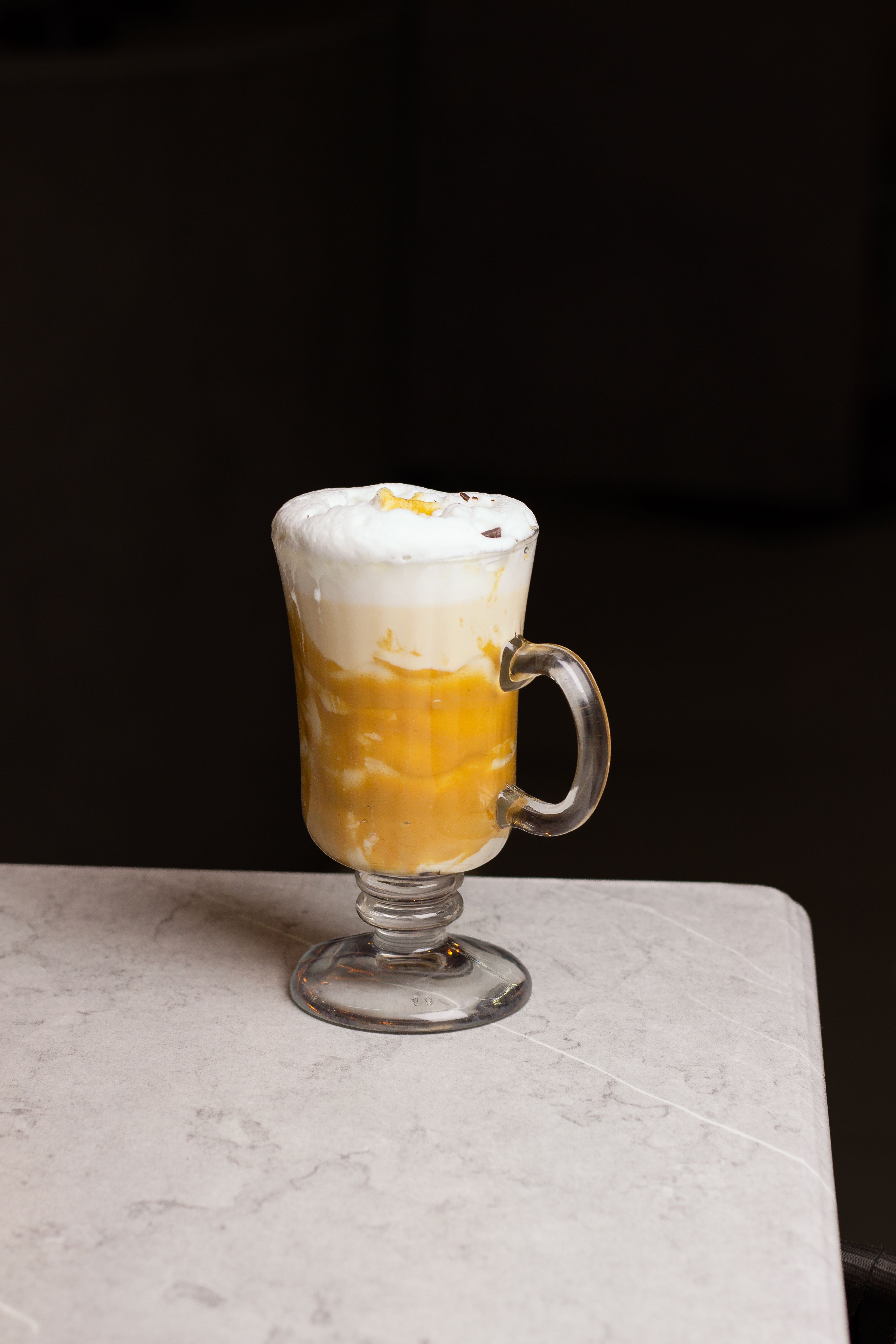 Frothy Mango Latte on Marble Table · Free Stock Photo