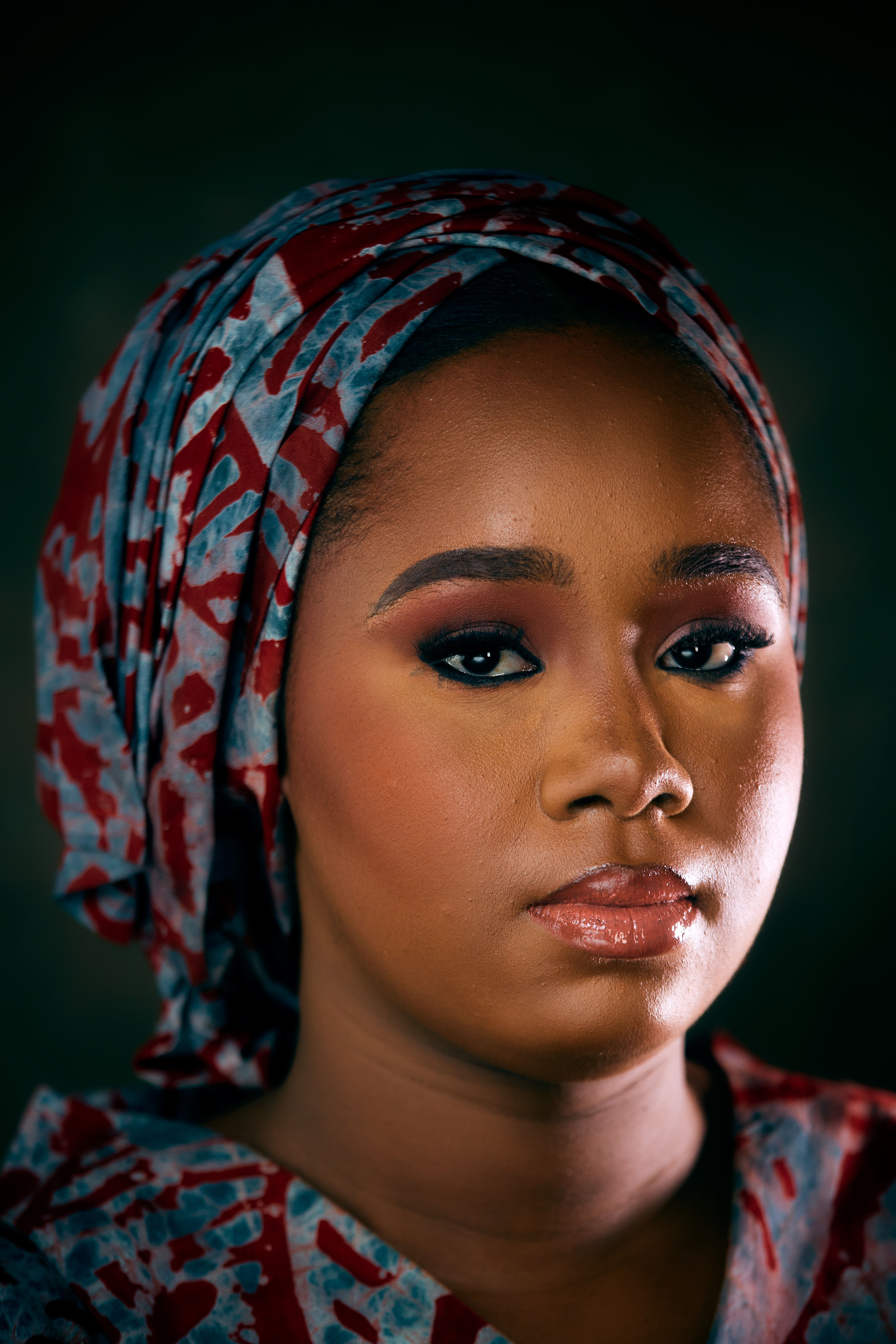 Beautiful Portrait of a Woman in Colorful Headscarf · Free Stock Photo