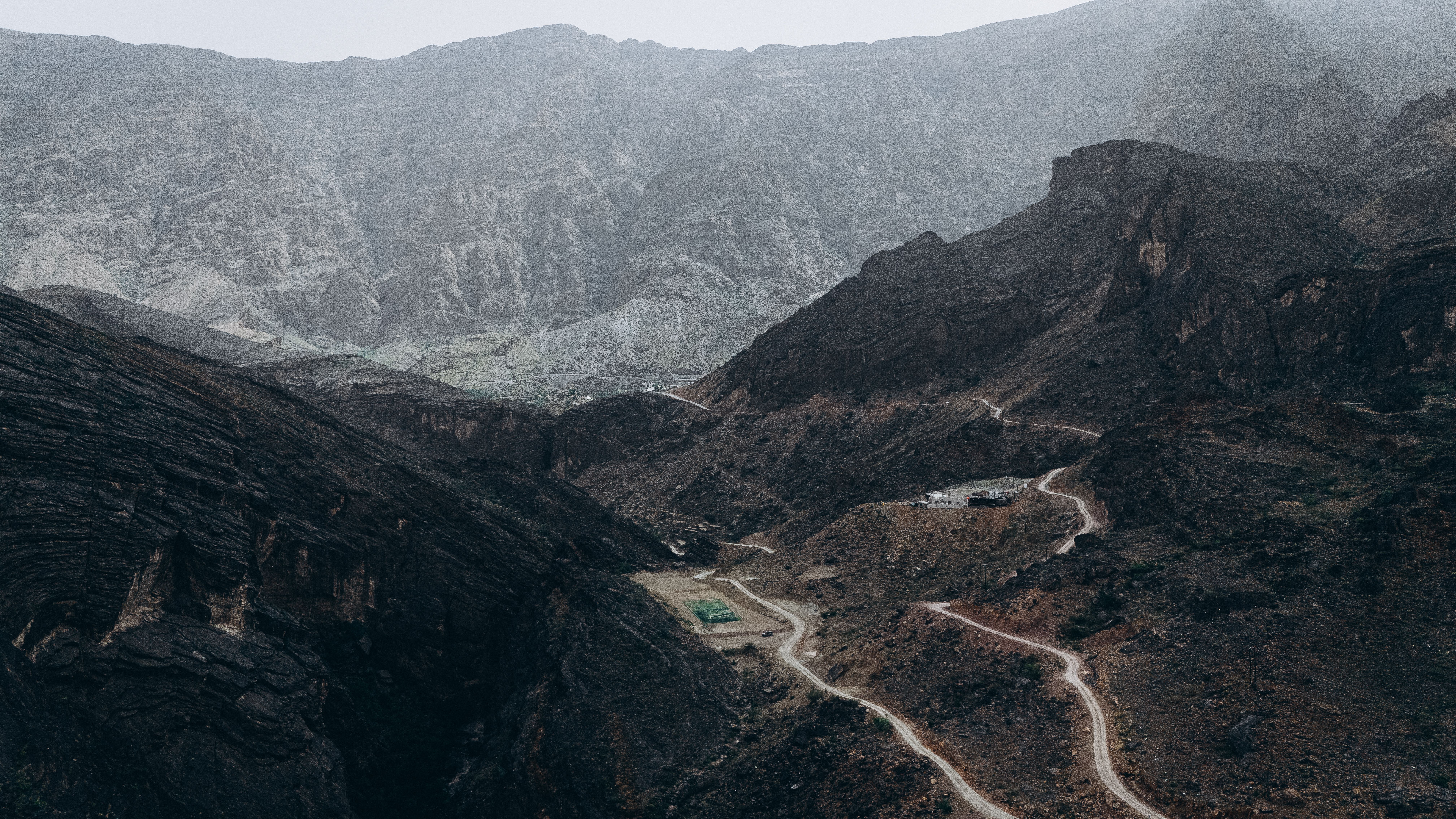 Aerial View of Rugged Mountain Terrain in Oman · Free Stock Photo