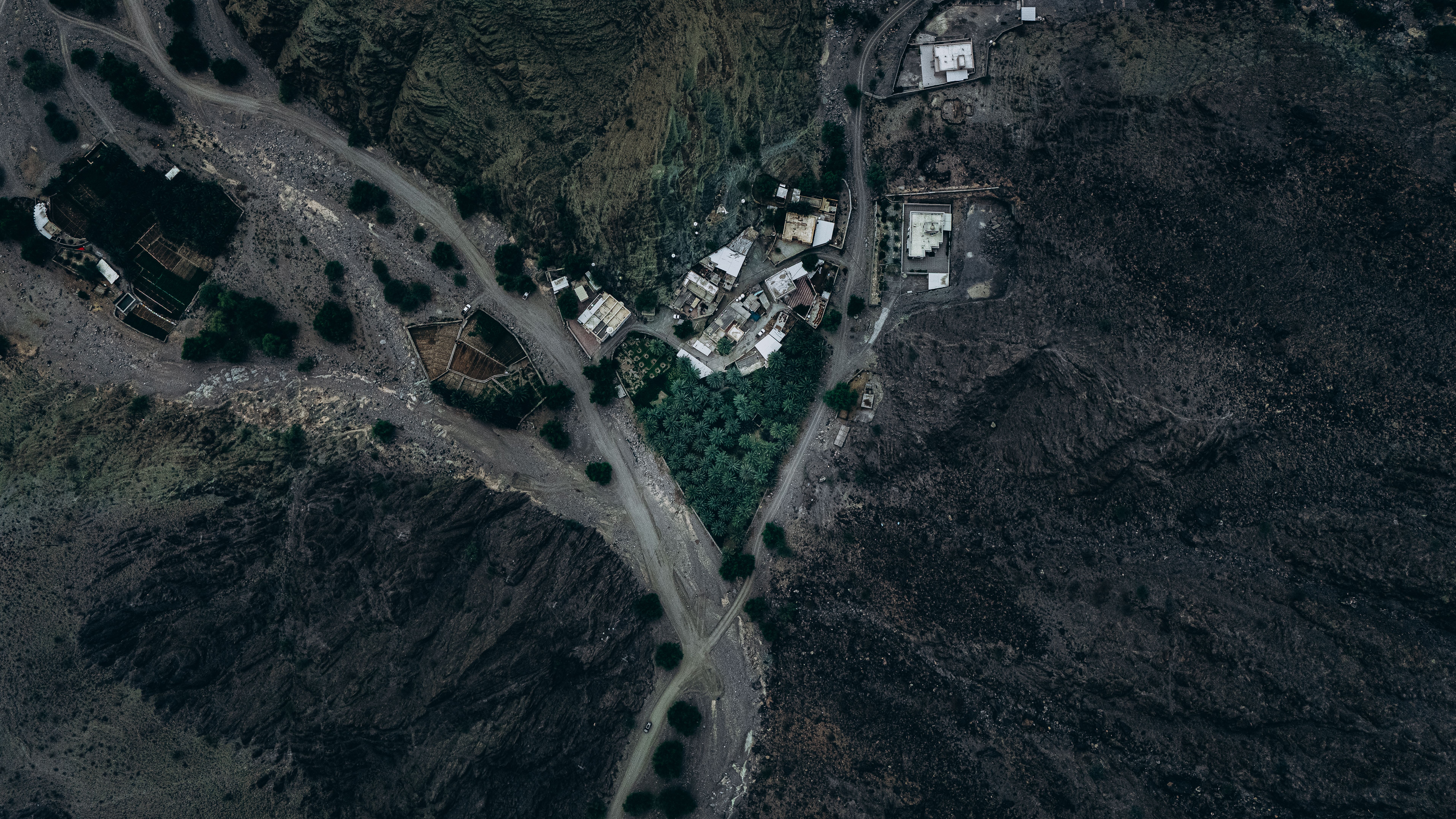 Aerial View of Oman Village Amid Rocky Terrain · Free Stock Photo