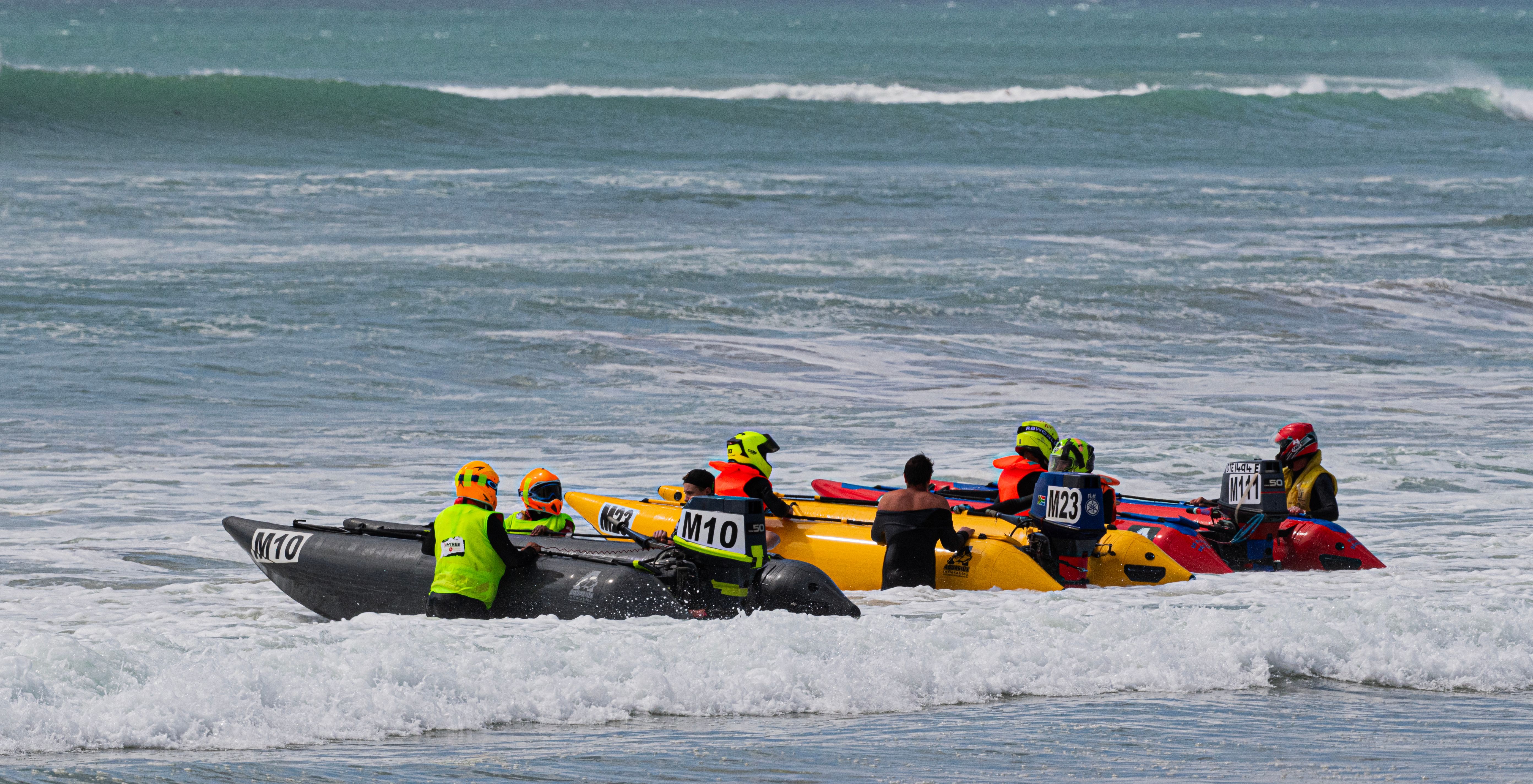 Exciting Inflatable Boat Race on Ocean Waves · Free Stock Photo