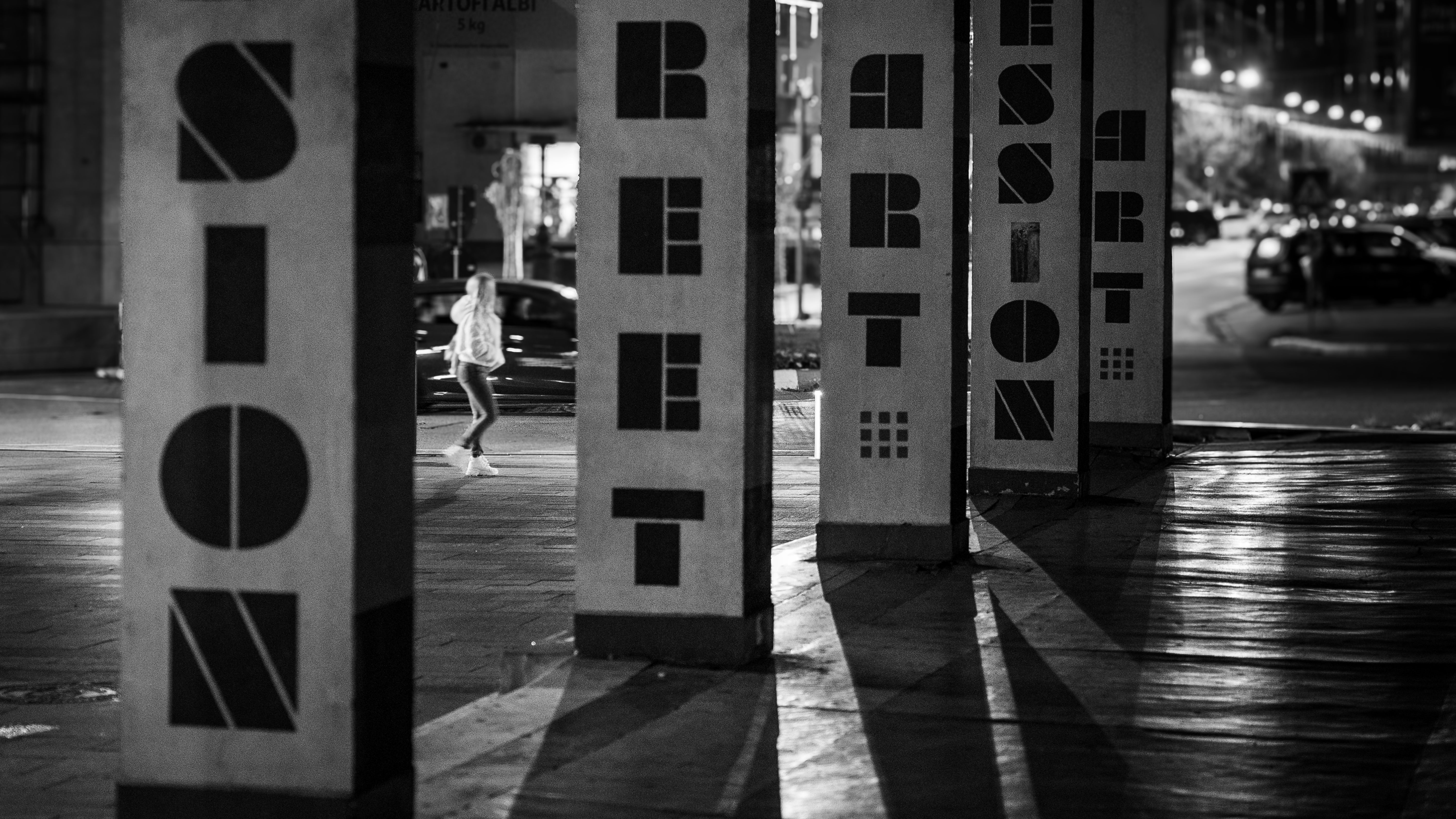 Urban Night Scene with Geometric Art Columns · Free Stock Photo