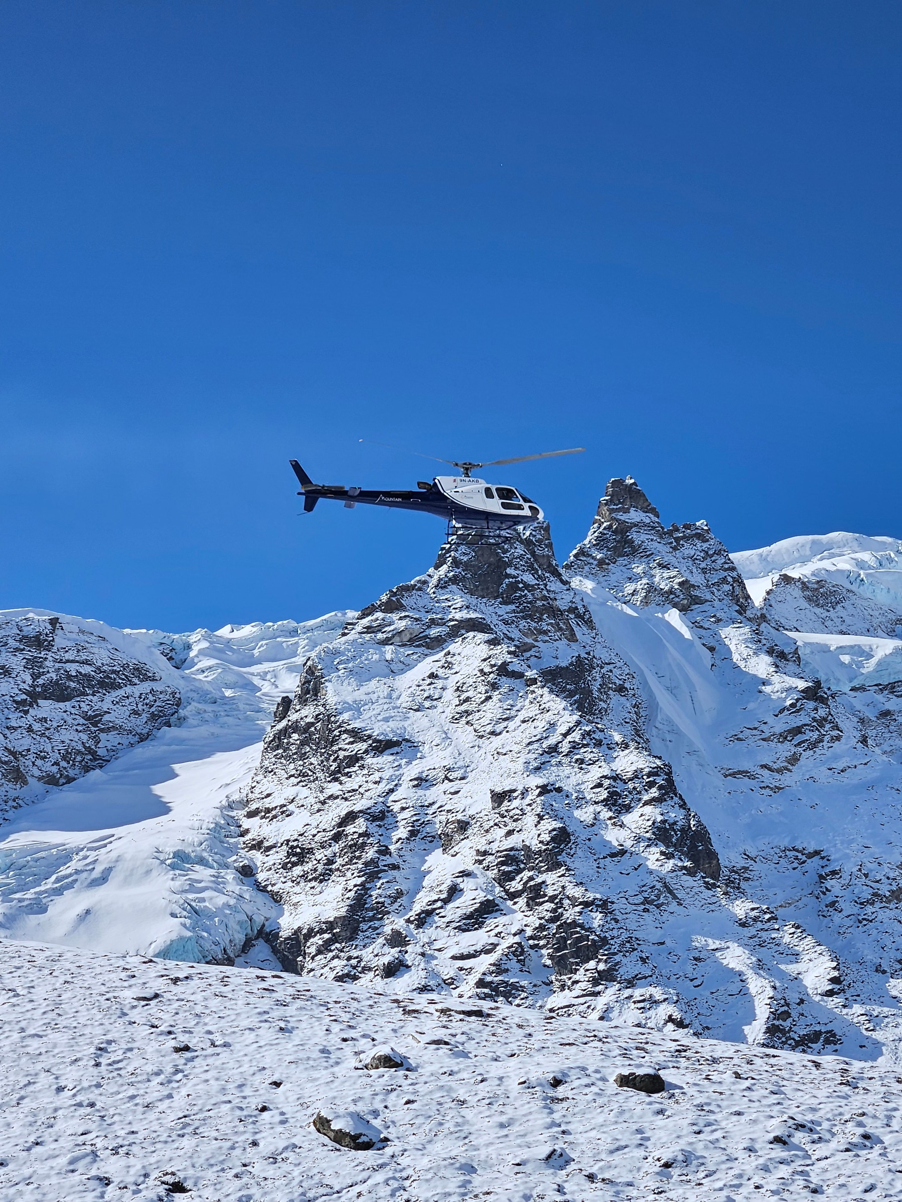 Helicopter Flying Over Snowy Himalayan Peaks in Nepal · Free Stock Photo