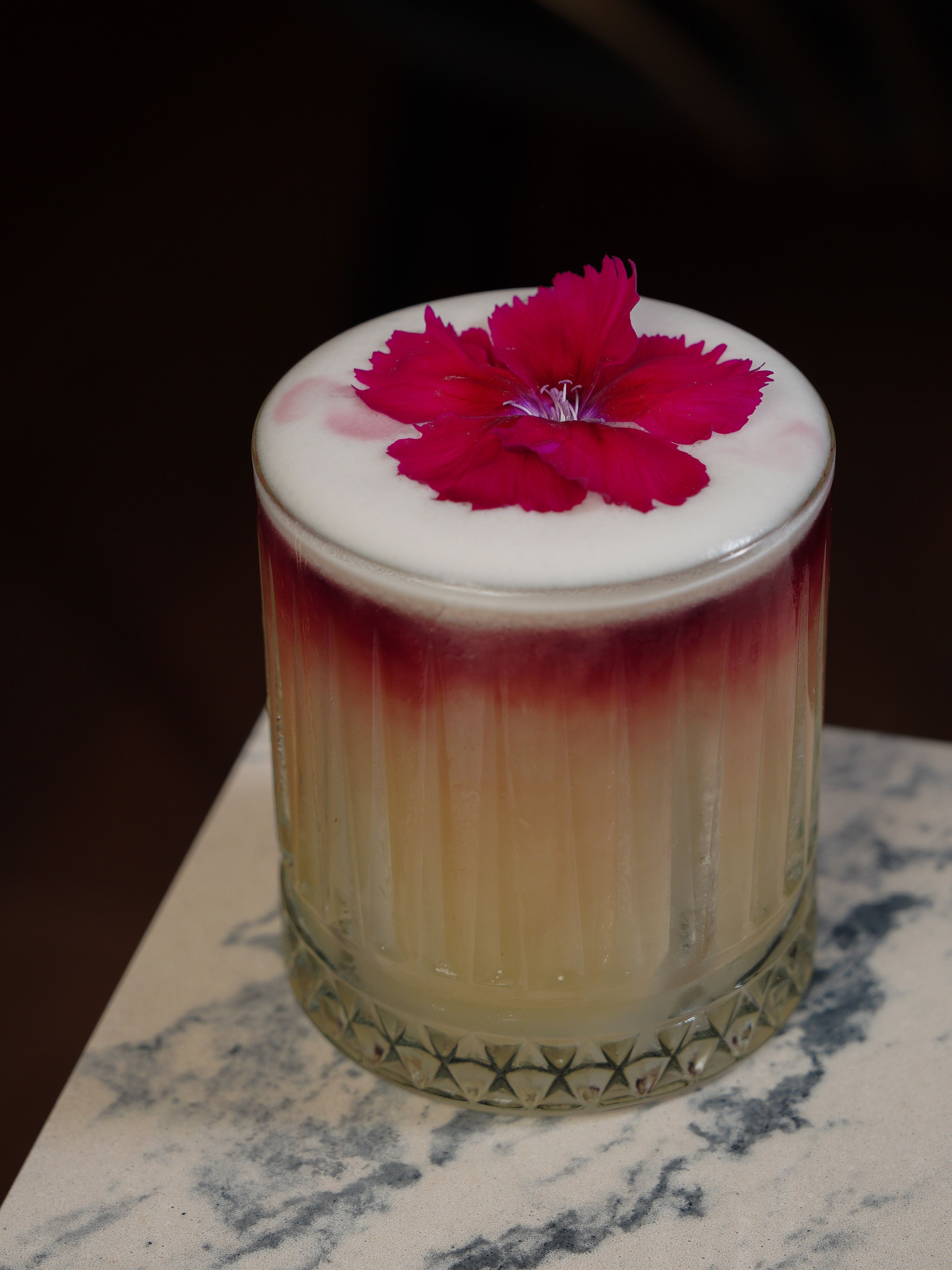 Elegant Cocktail with Pink Flower Garnish · Free Stock Photo