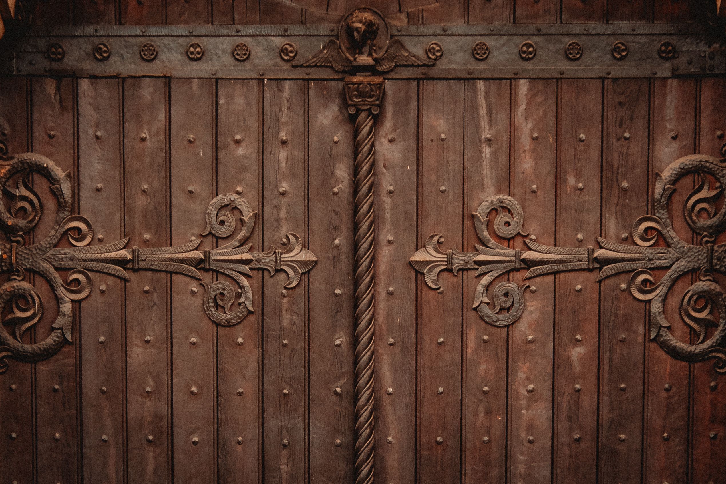 Intricate Wooden Church Doors with Metalwork · Free Stock Photo