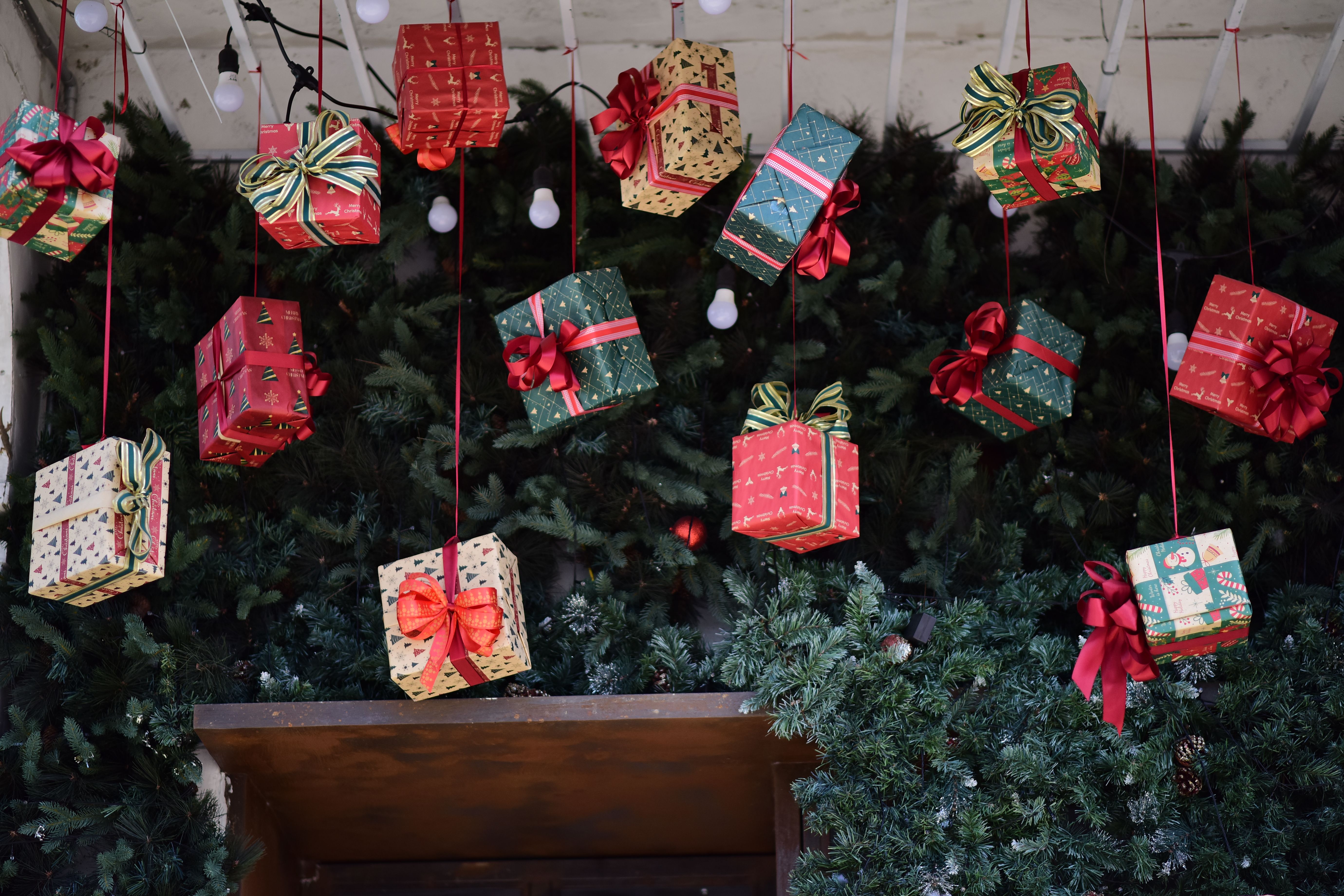 Festive Christmas Gift Boxes Hanging in Decor · Free Stock Photo