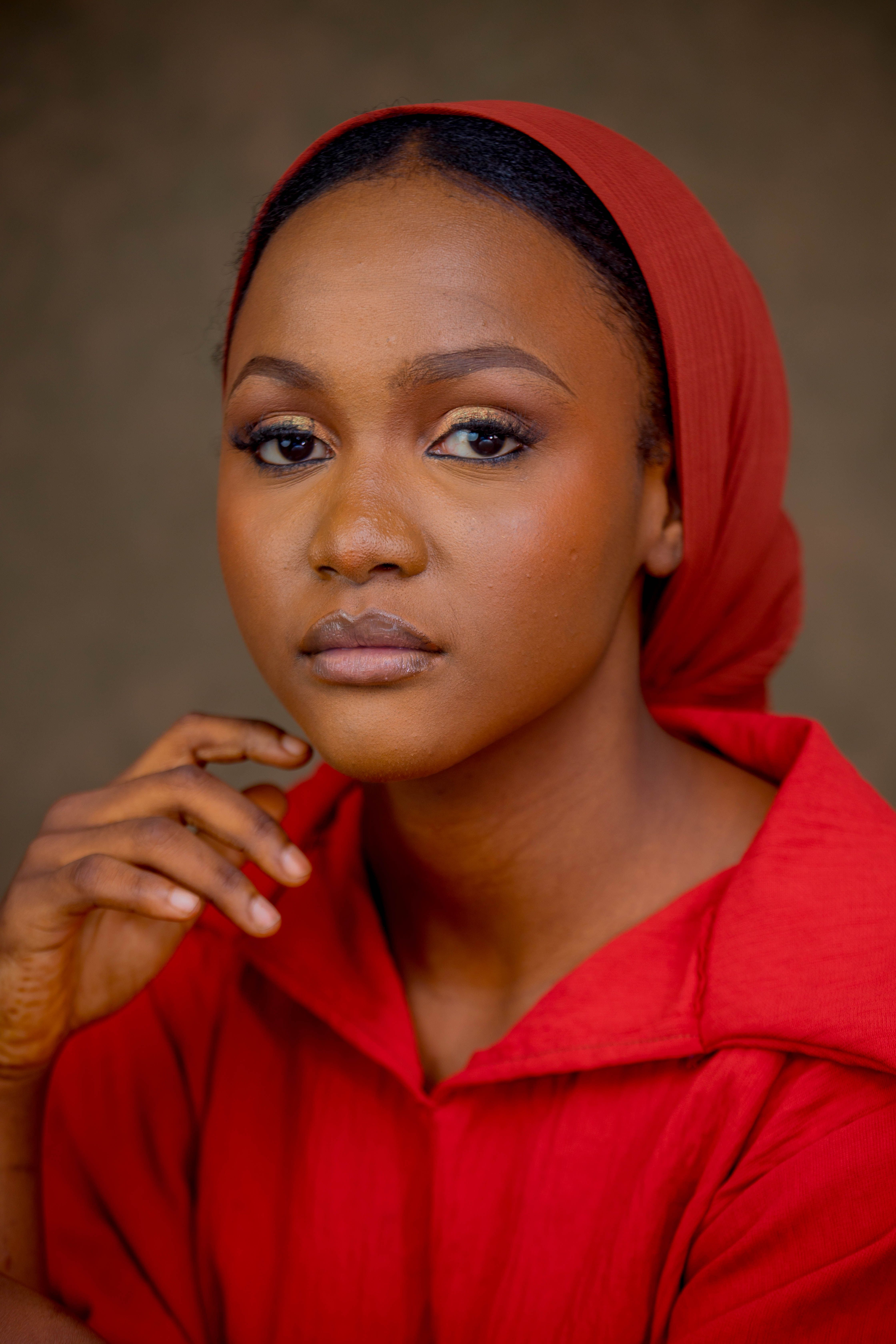 Elegant Portrait of a Woman in Red Headscarf · Free Stock Photo