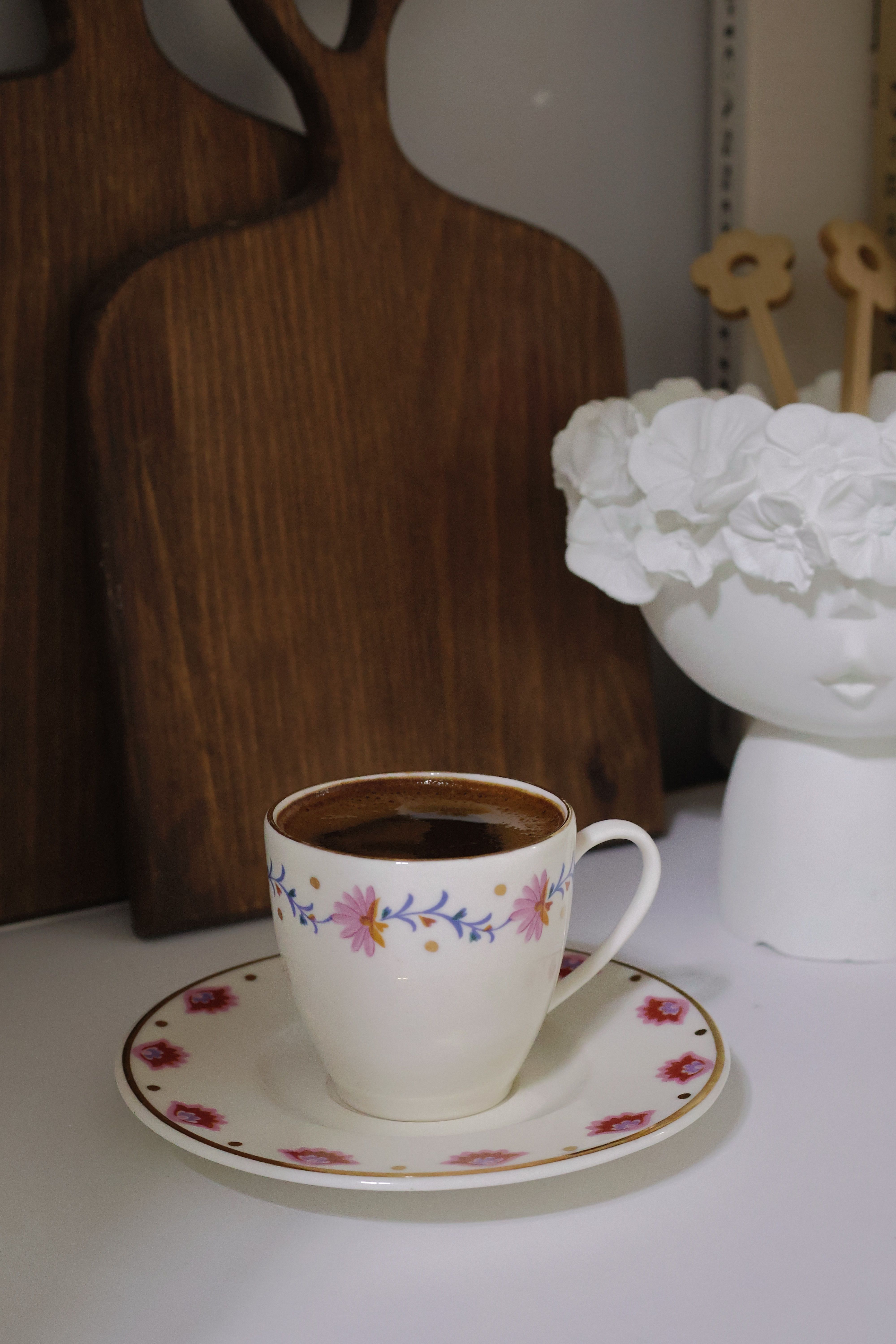 Elegant Floral Teacup with Rustic Cutting Boards · Free Stock Photo