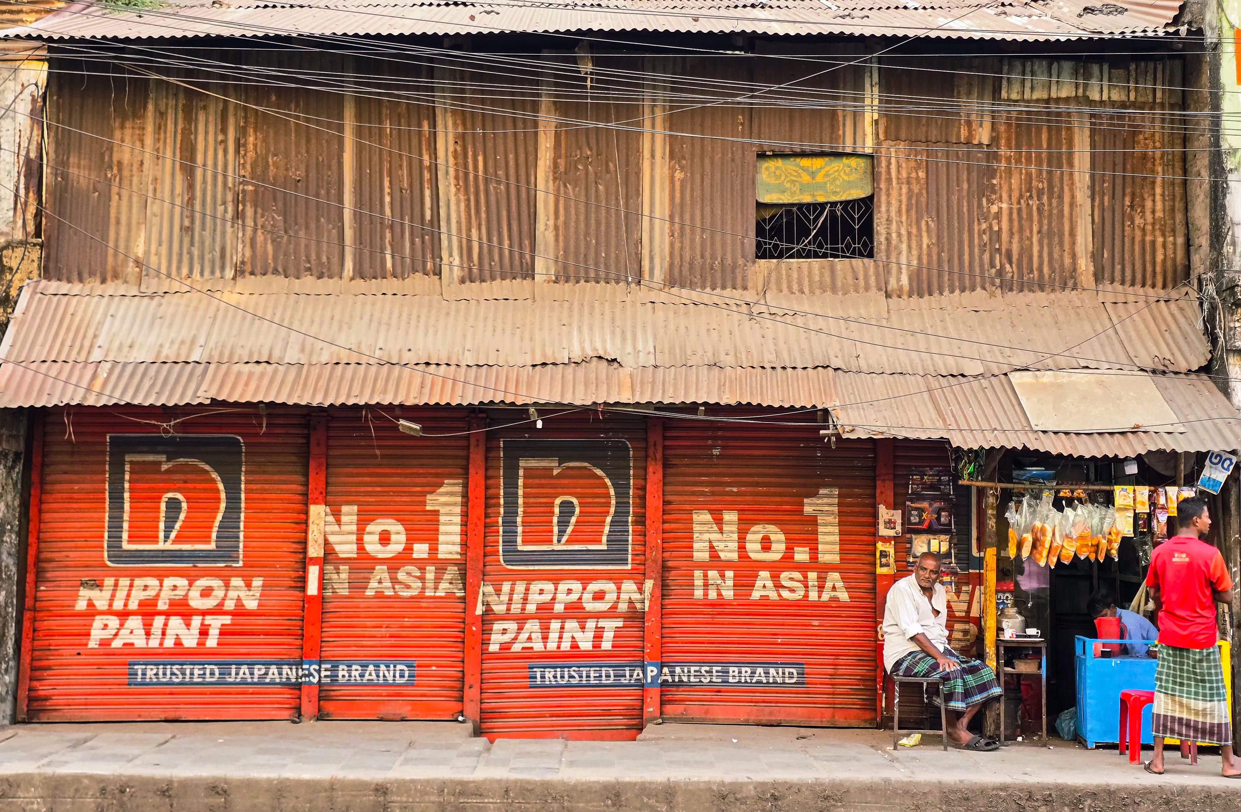 Street Scene with Storefront and Local Vendors · Free Stock Photo