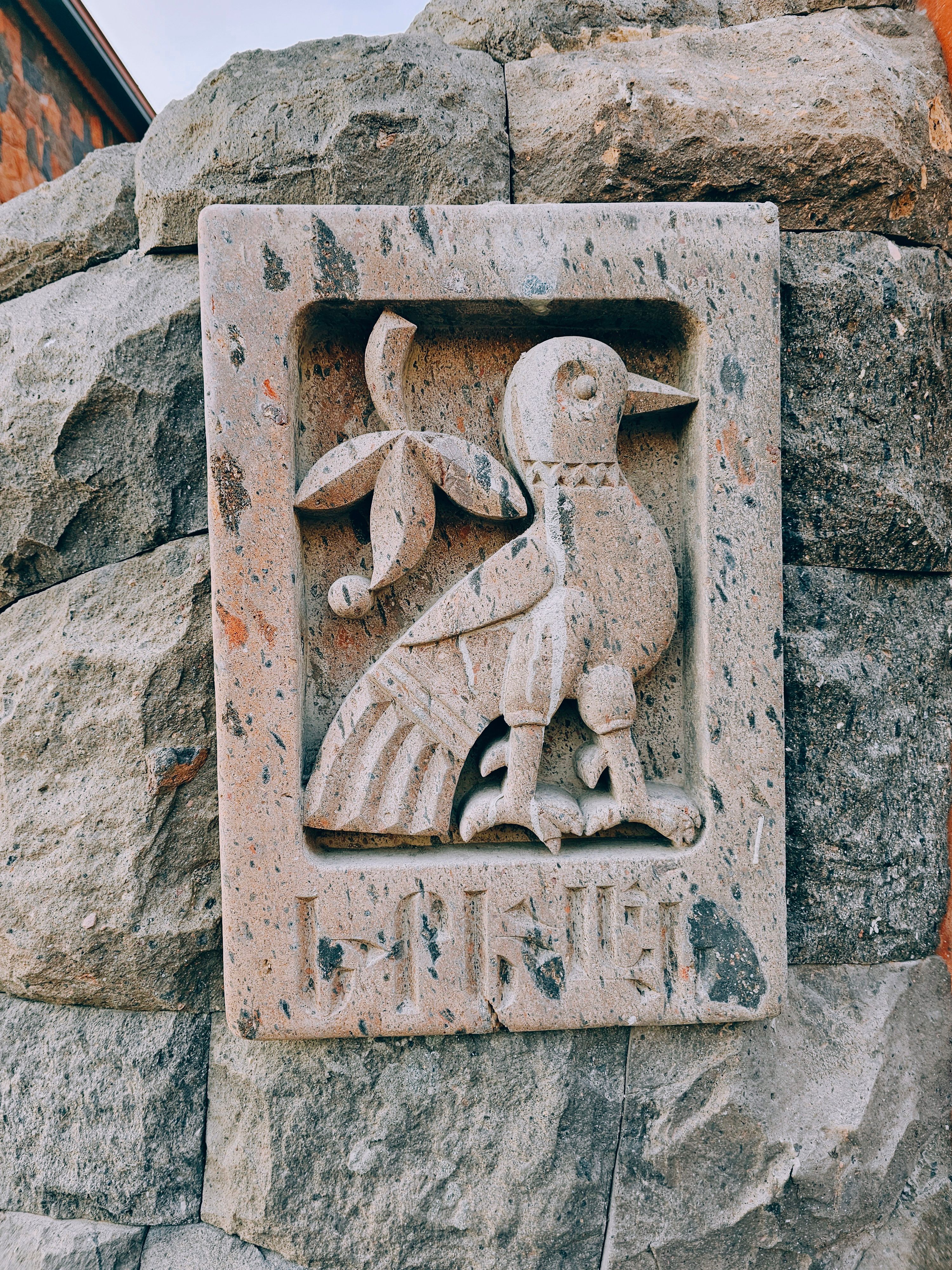 Stone Carved Relief of Bird on Rock Wall · Free Stock Photo
