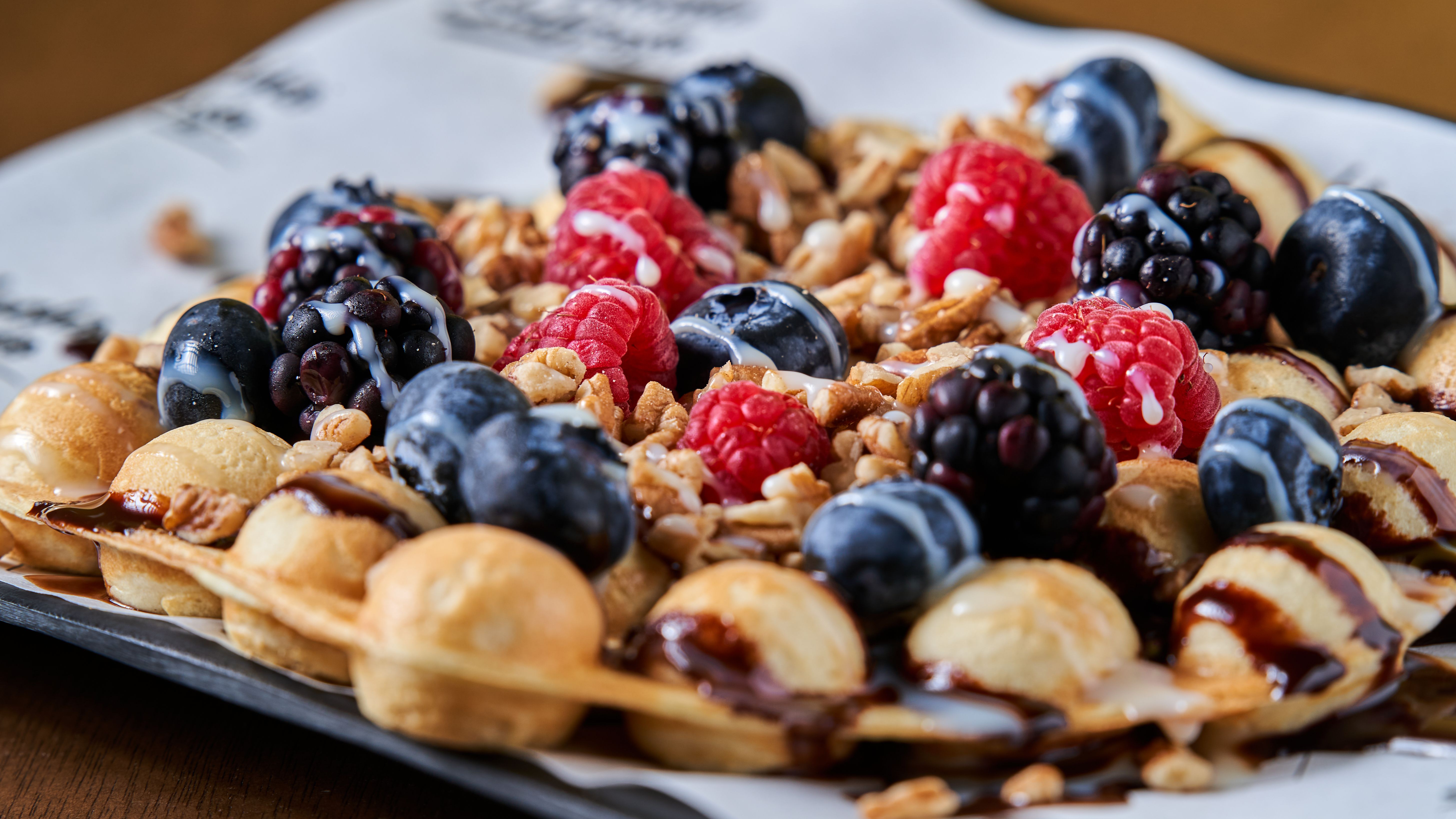 Bubble waffles with mixed berries and nuts · Free Stock Photo