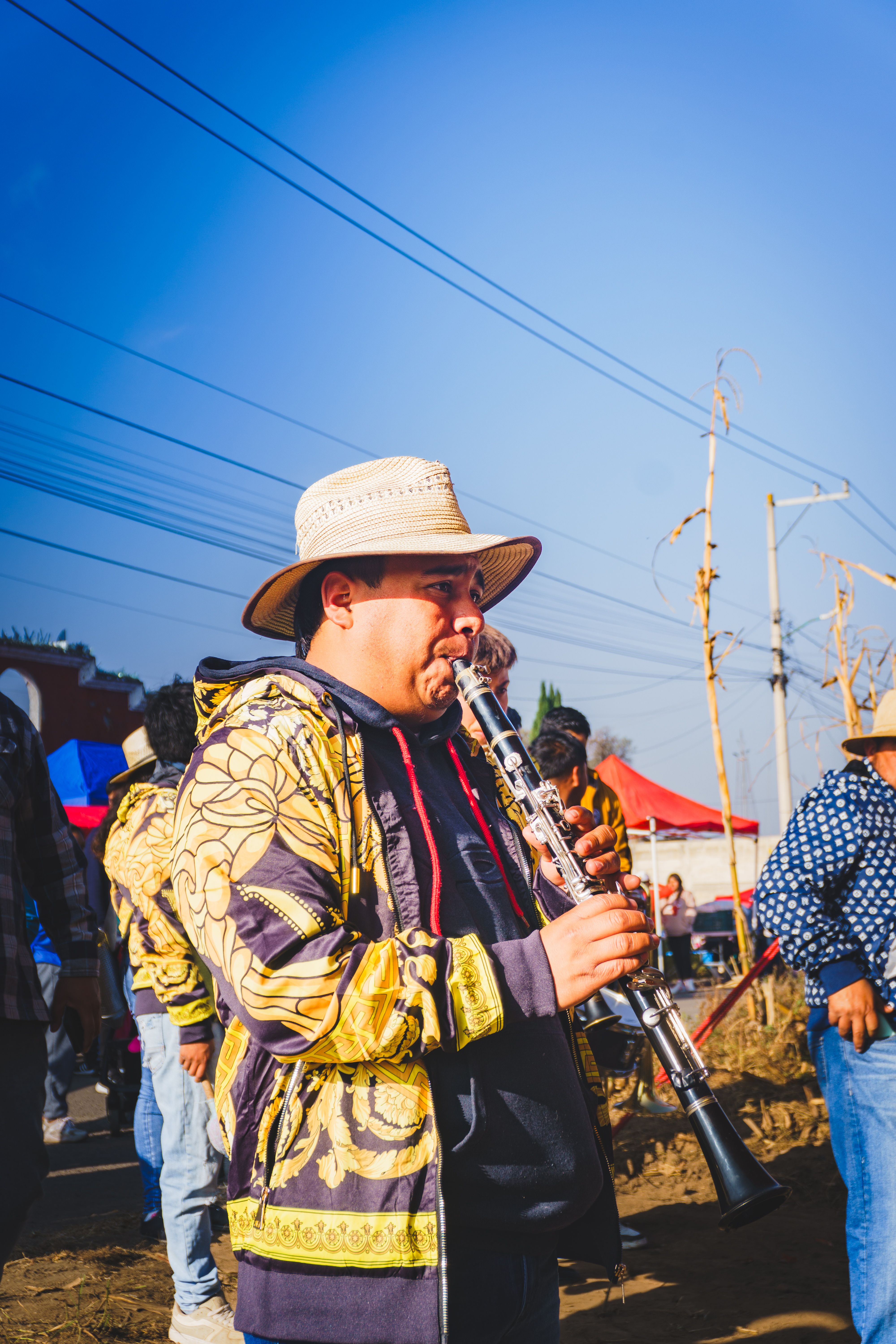 Street Performer Playing Clarinet at Outdoor Festival · Free Stock Photo