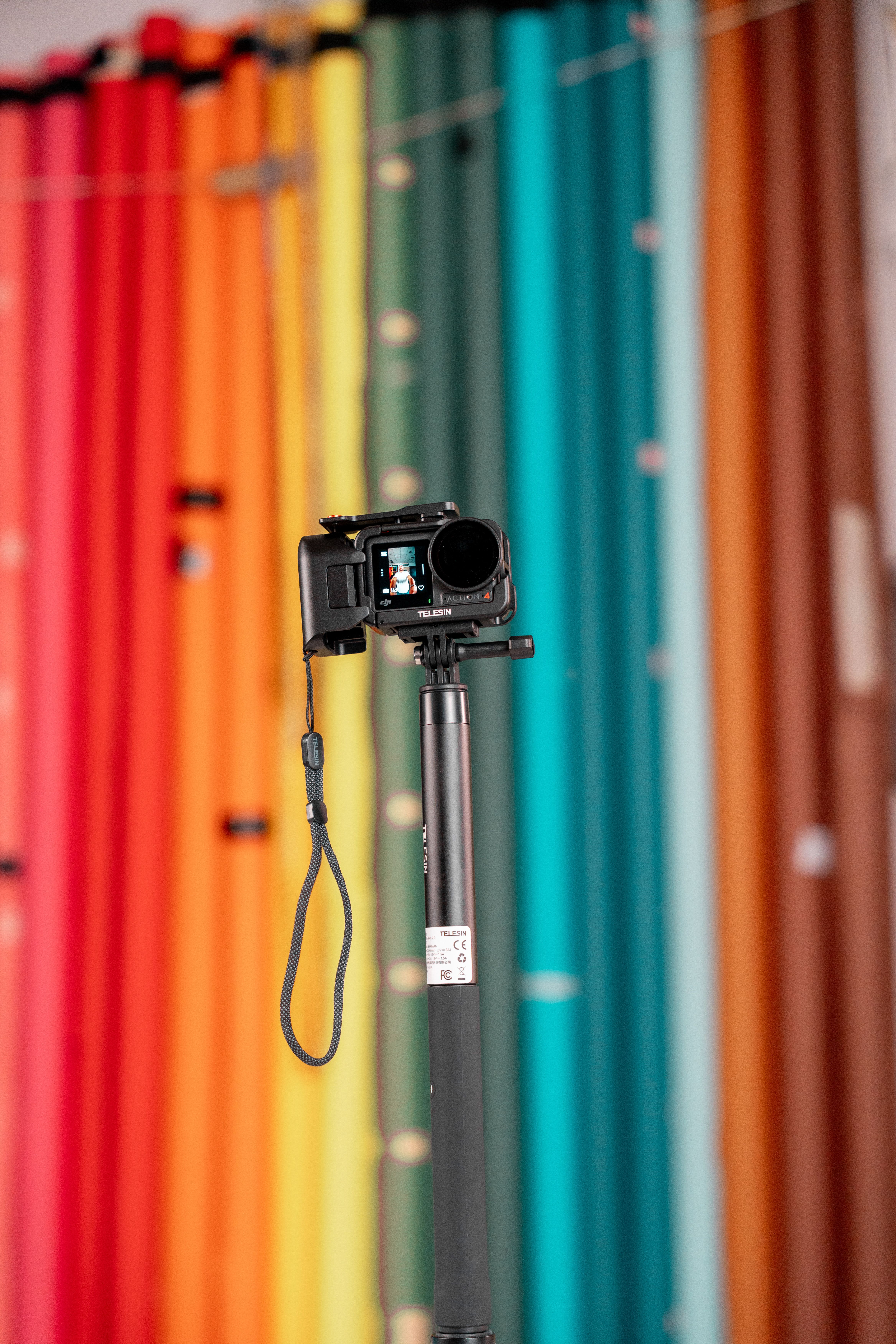 Colorful Backdrop with Action Camera on Monopod · Free Stock Photo