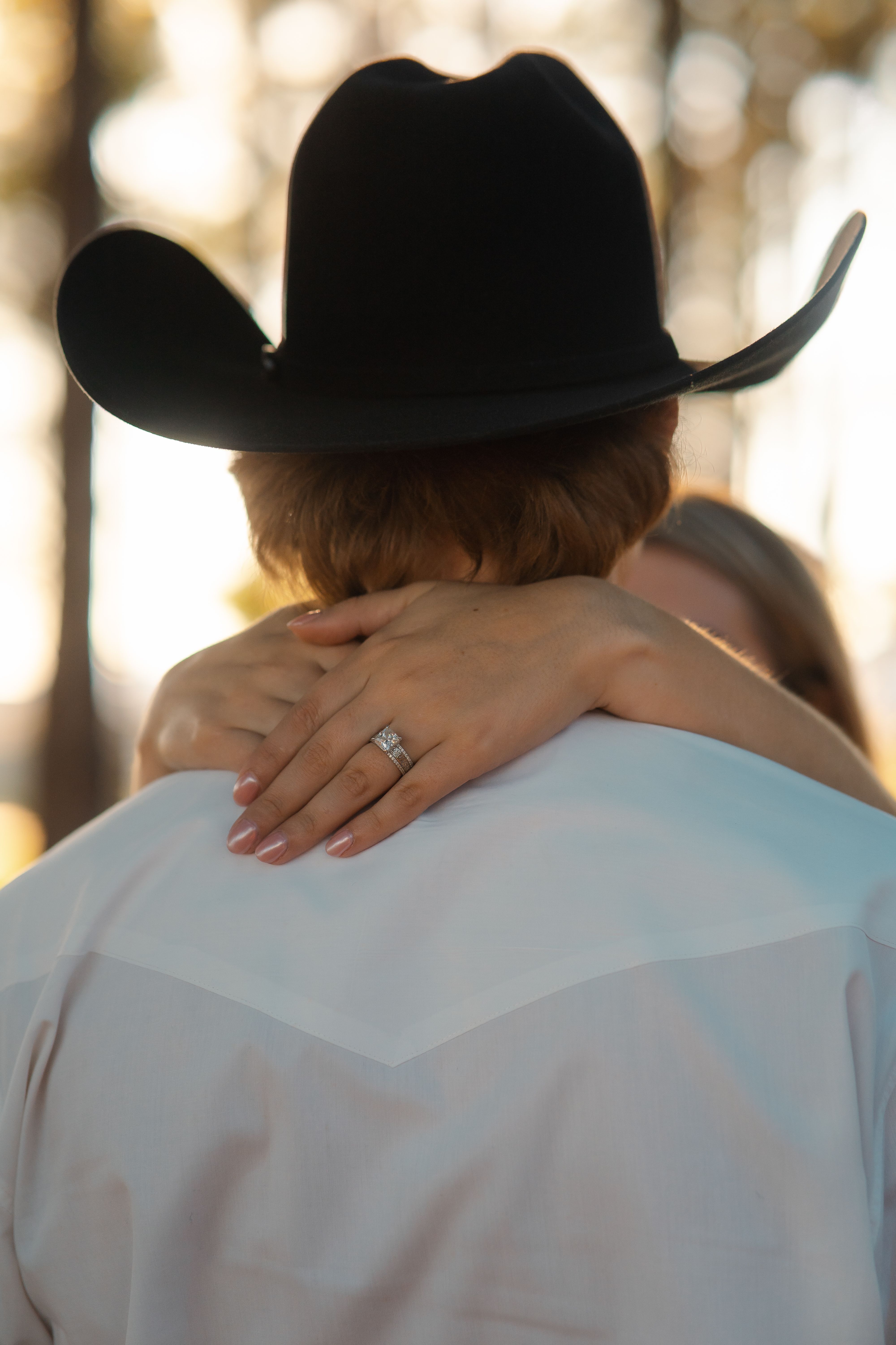 Romantic Embrace of Cowboy and Partner at Sunset · Free Stock Photo