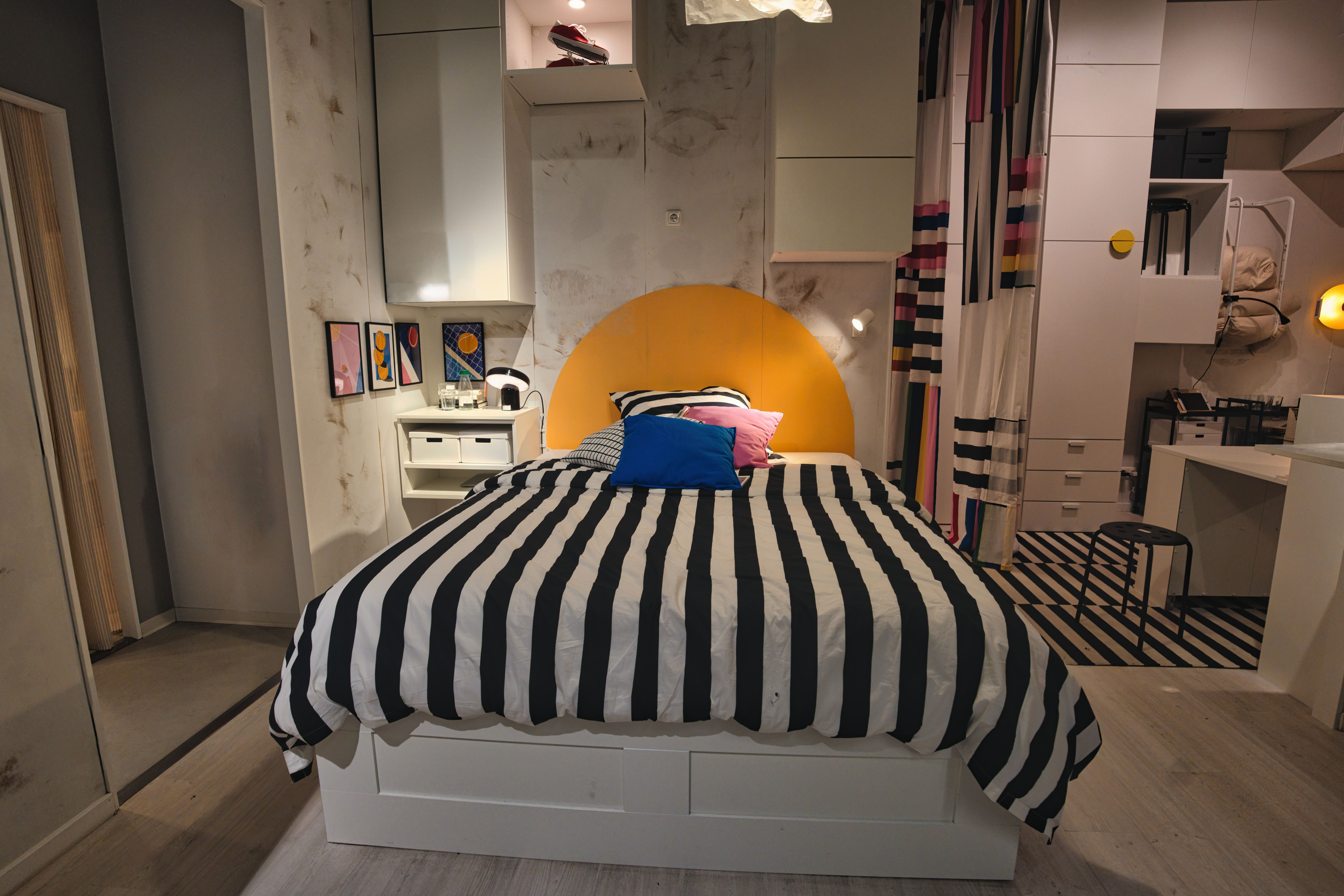 Modern Bedroom with Striped Bedding and Bold Colors · Free Stock Photo