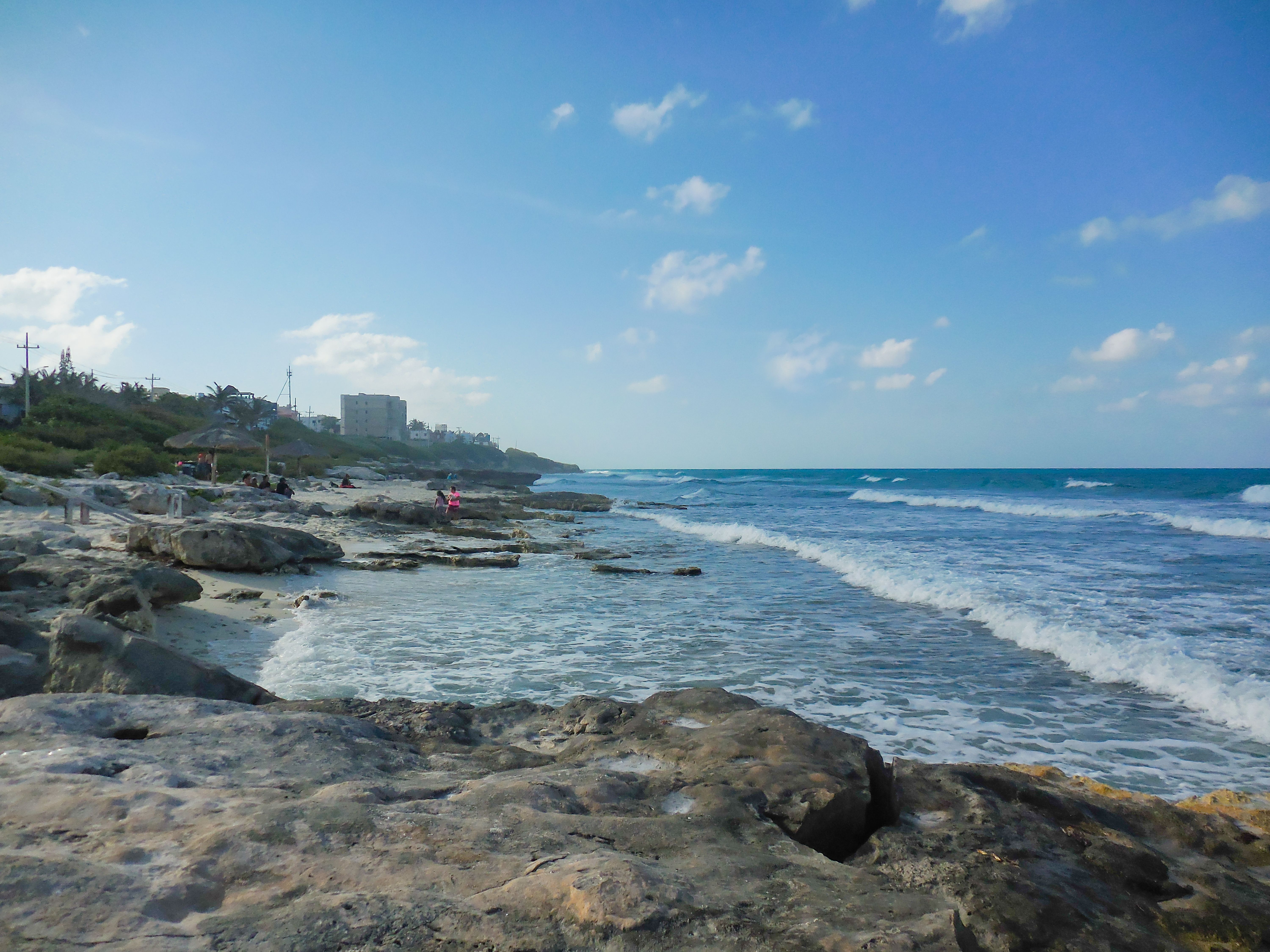 Serene Coastal Rocks and Waves at Daytime Beach · Free Stock Photo