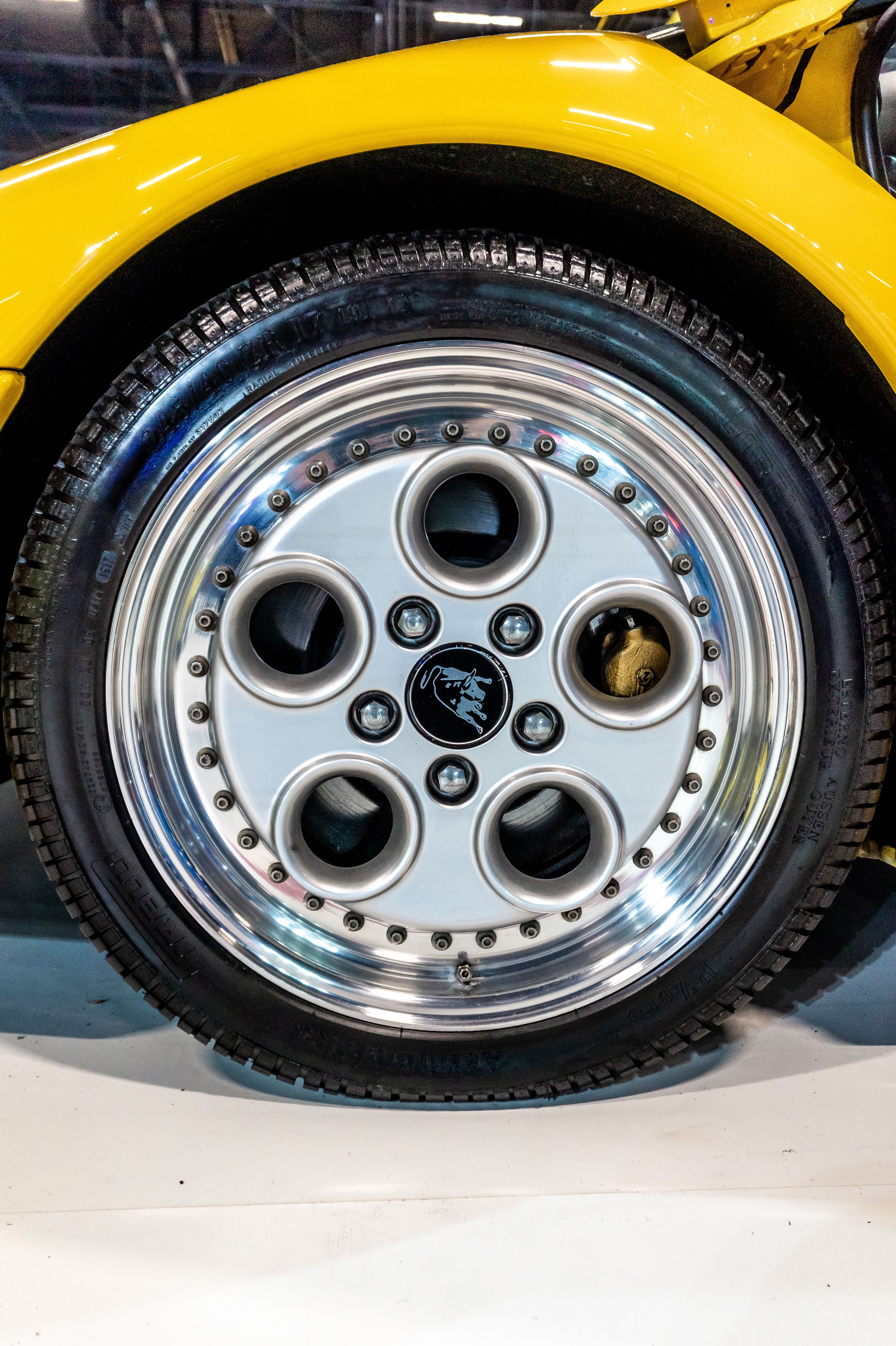 Close-up of Luxury Car Wheel Rim in Showroom · Free Stock Photo