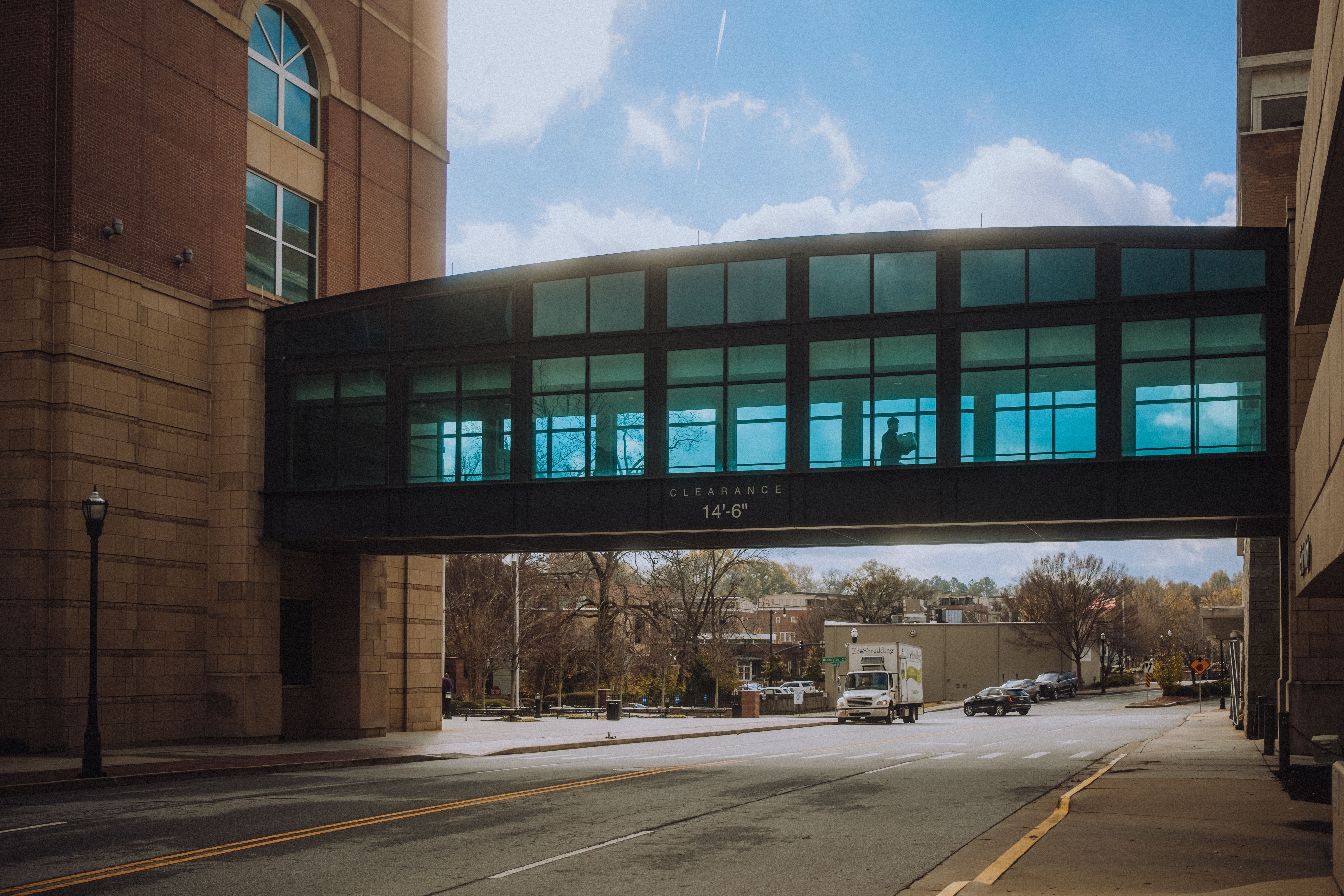 Urban Street View with Elevated Walkway and Blue Sky · Free Stock Photo