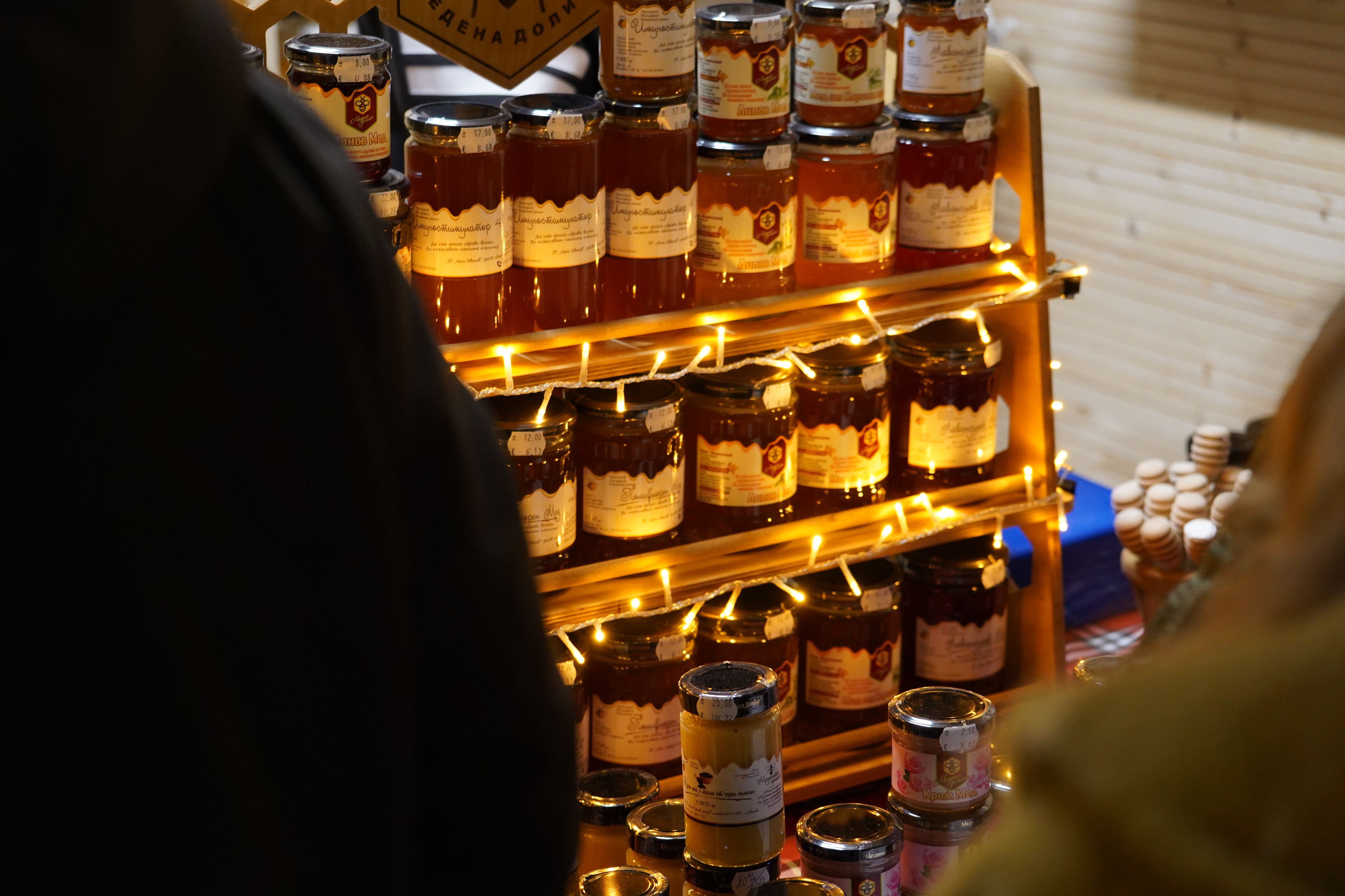 Illuminated Display of Assorted Honey Jars · Free Stock Photo