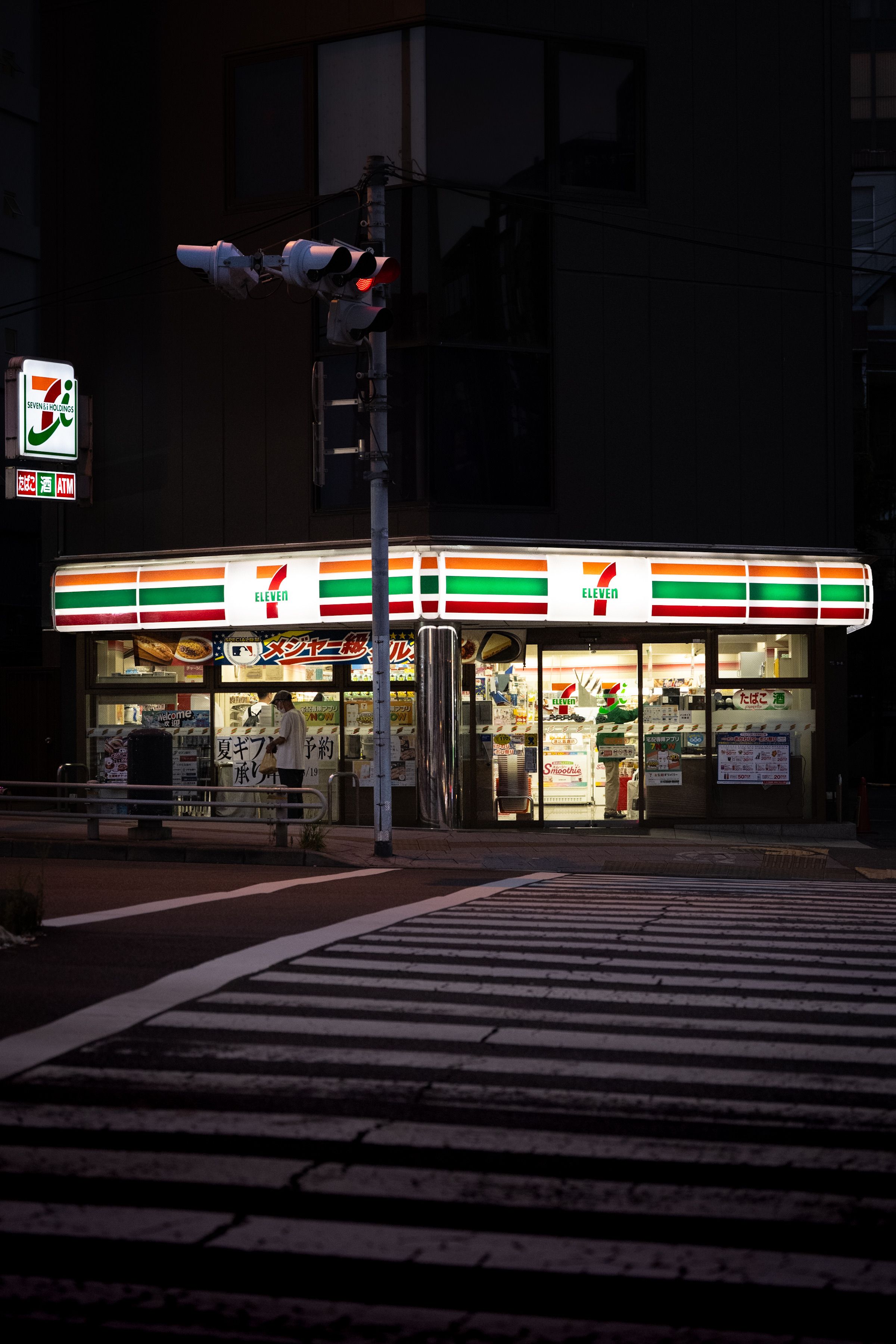 Illuminated Convenience Store in Urban Japan at Night · Free Stock Photo