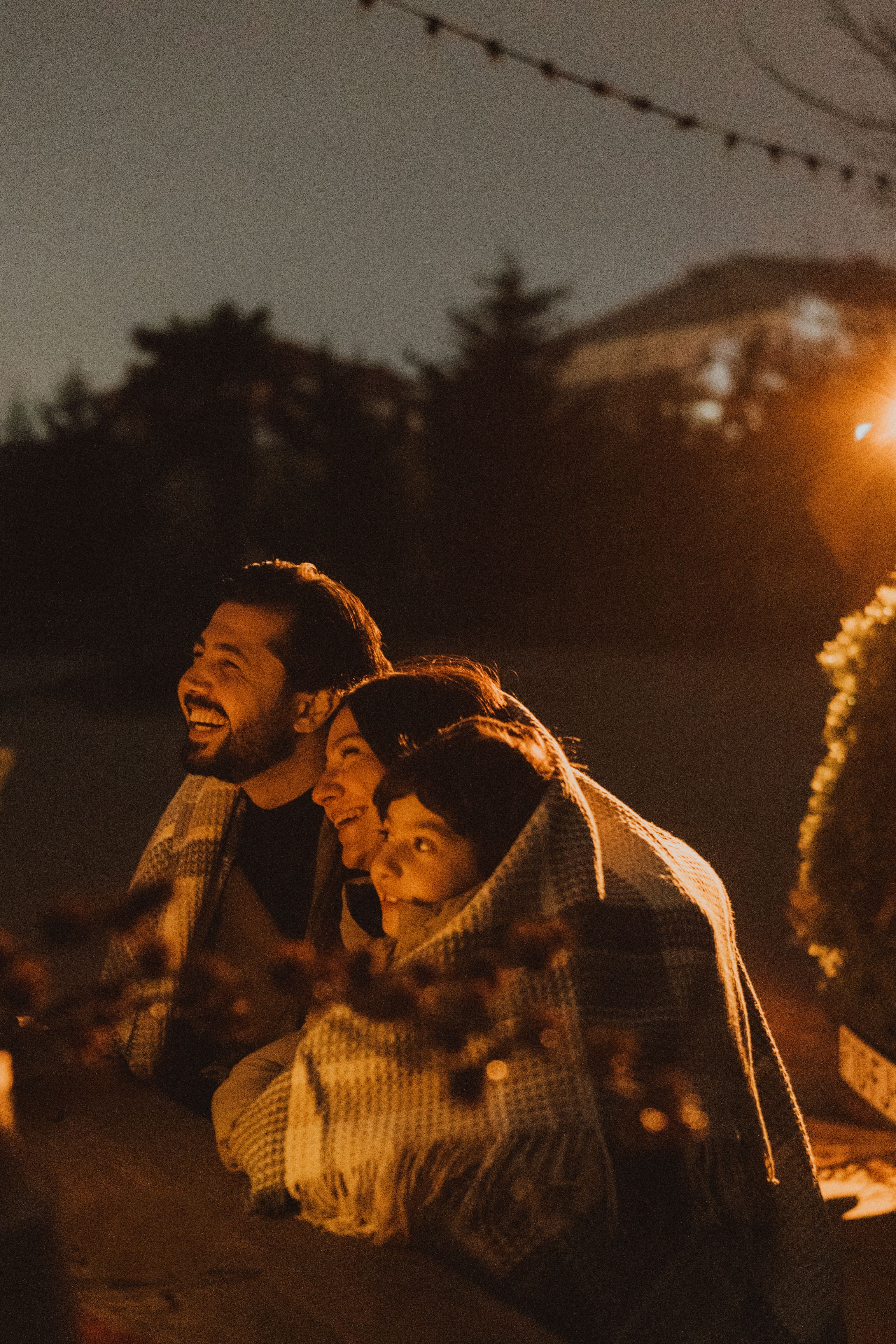 Family Enjoying Cozy Night by Firelight · Free Stock Photo