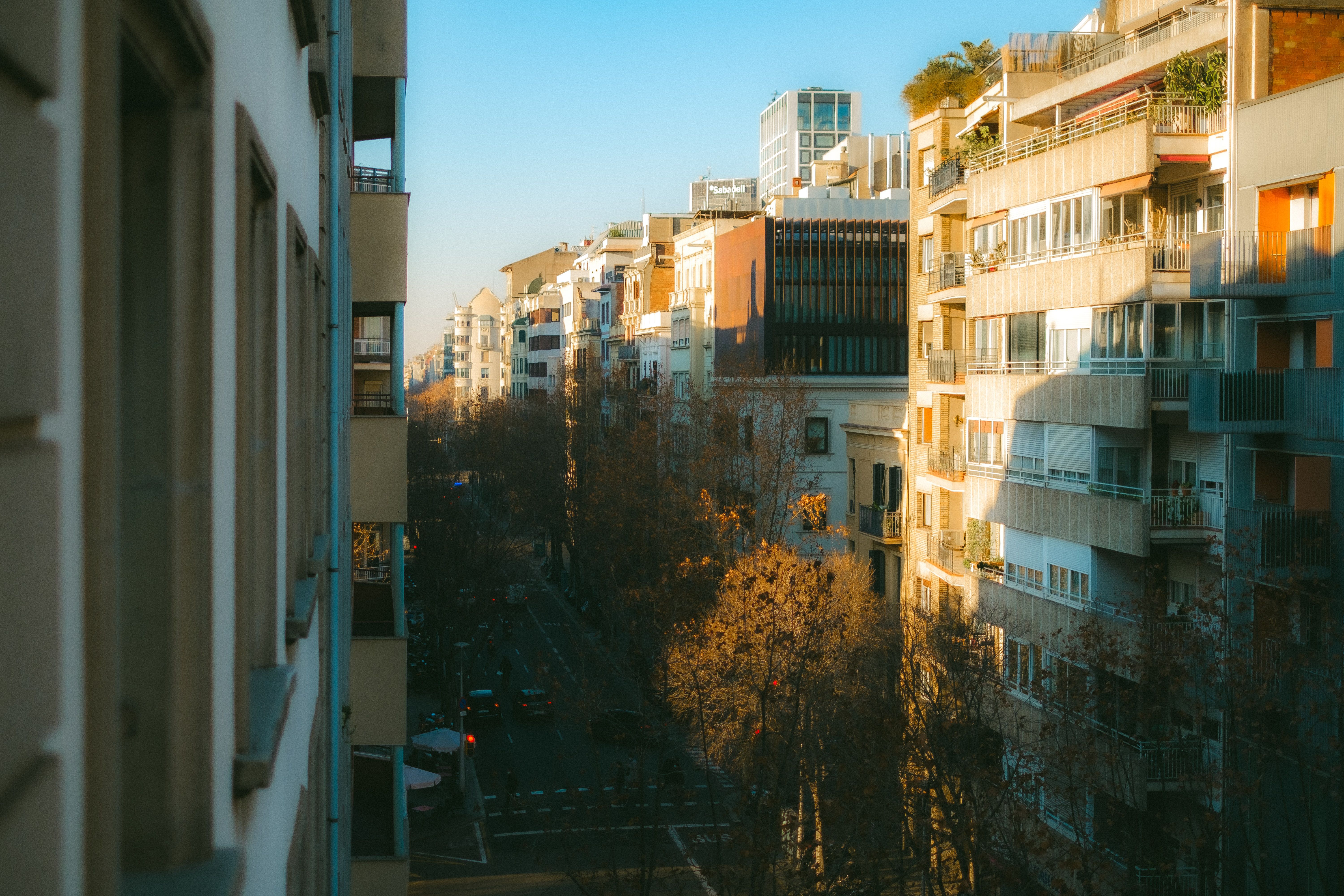 Urban Street View with Modern Buildings at Sunset · Free Stock Photo