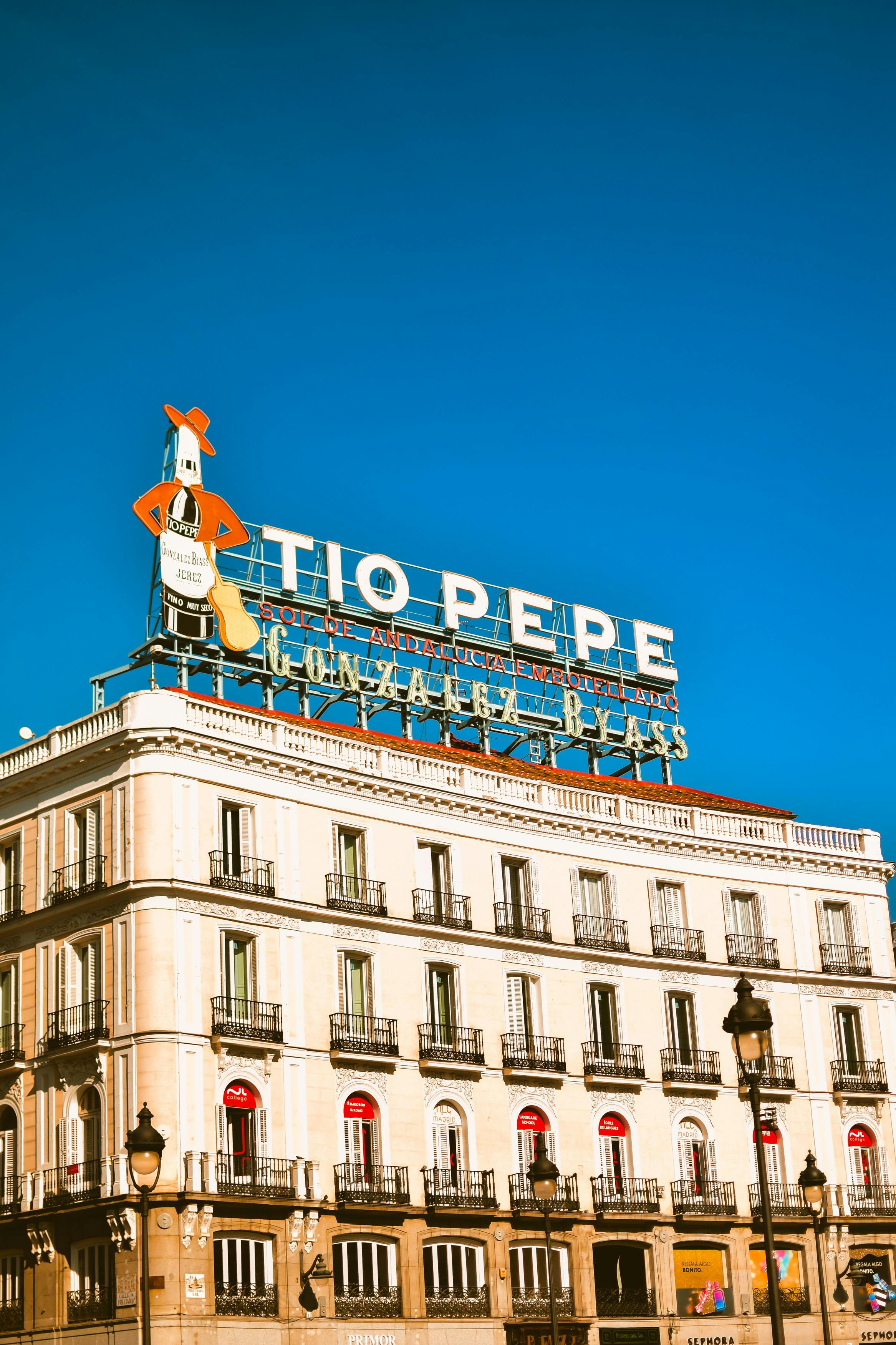 Tio Pepe Sign on Historic Madrid Building · Free Stock Photo