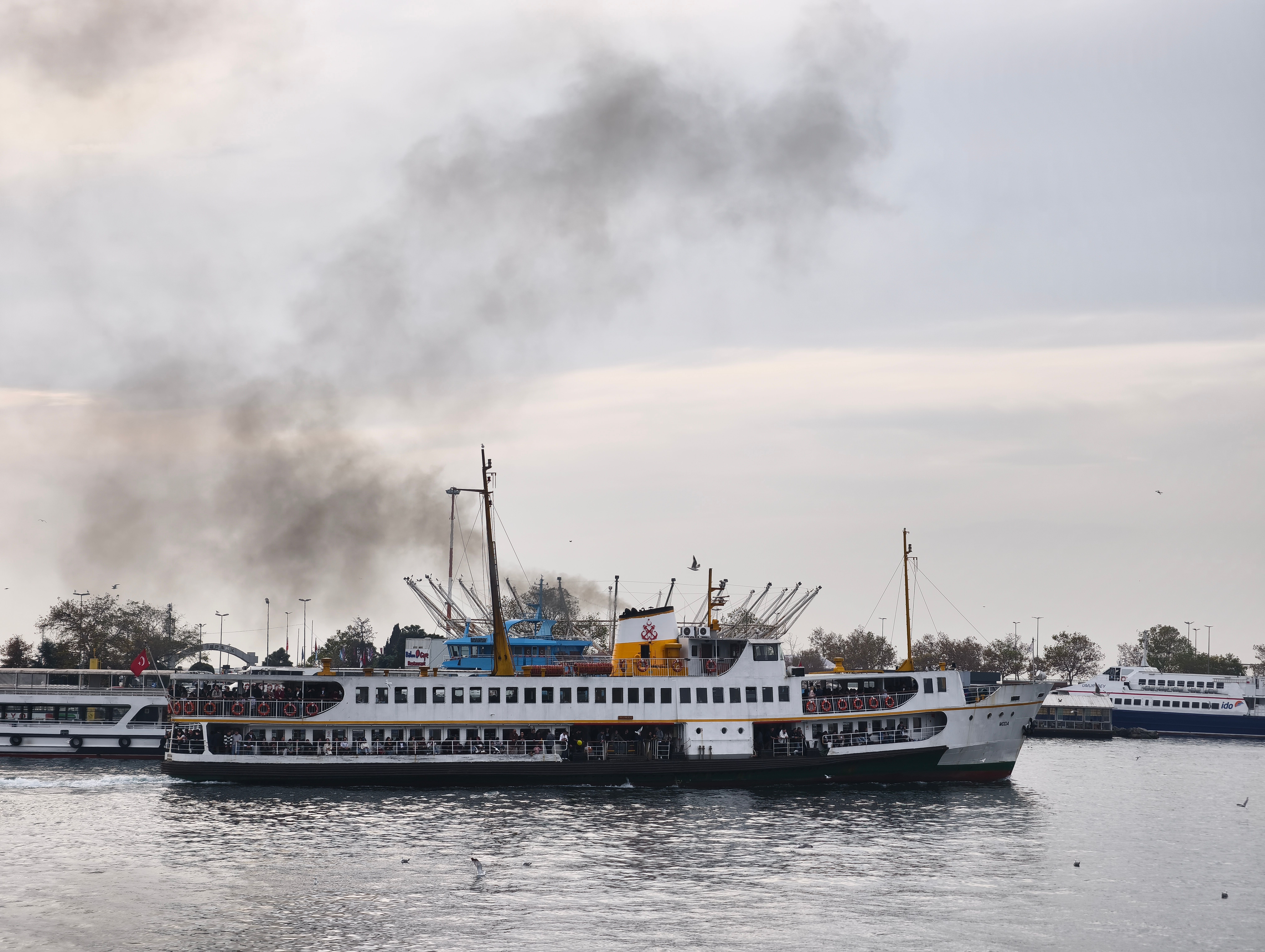 Passenger Ferry Emitting Smoke on a Calm Day · Free Stock Photo
