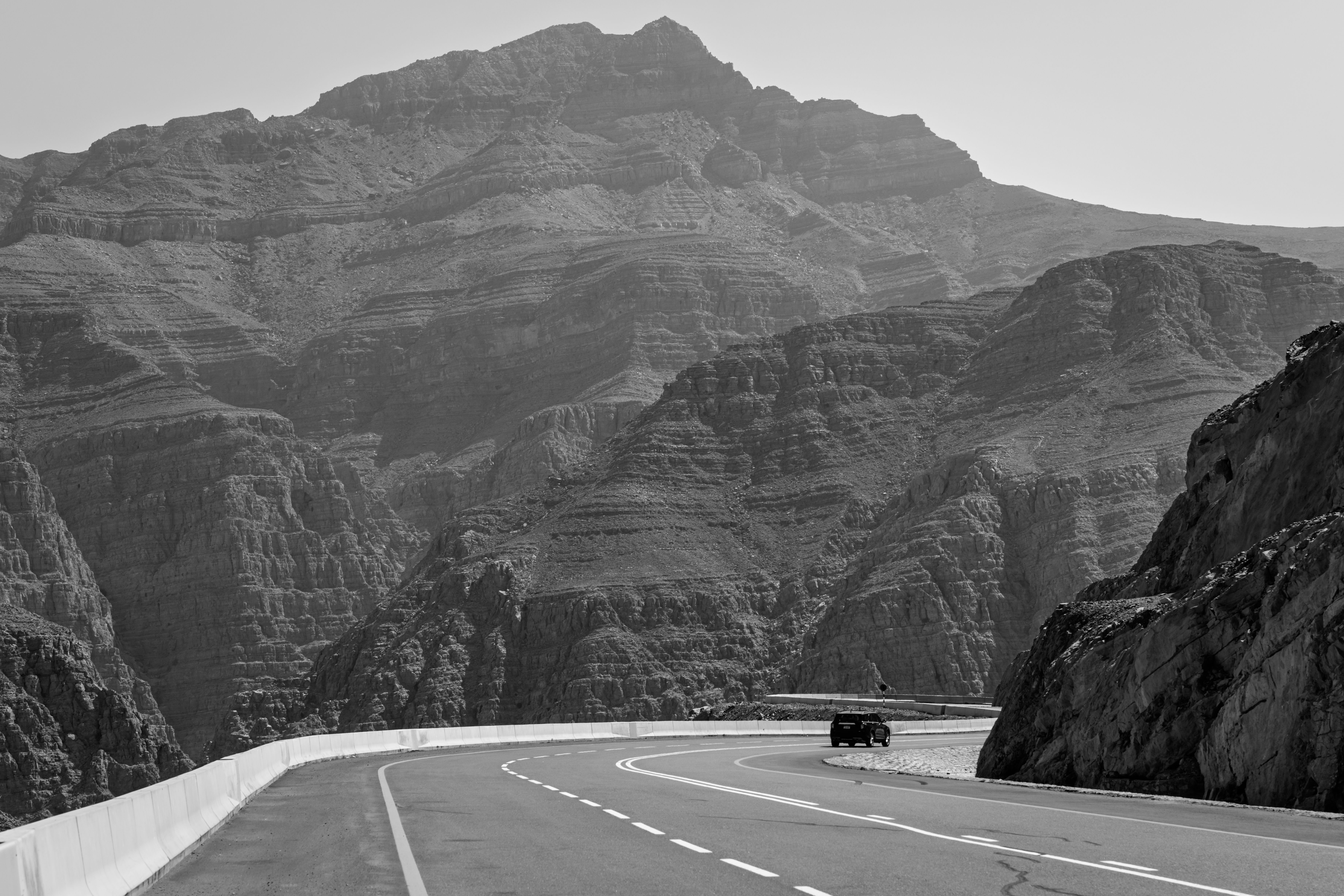Scenic mountain road with rugged landscape · Free Stock Photo