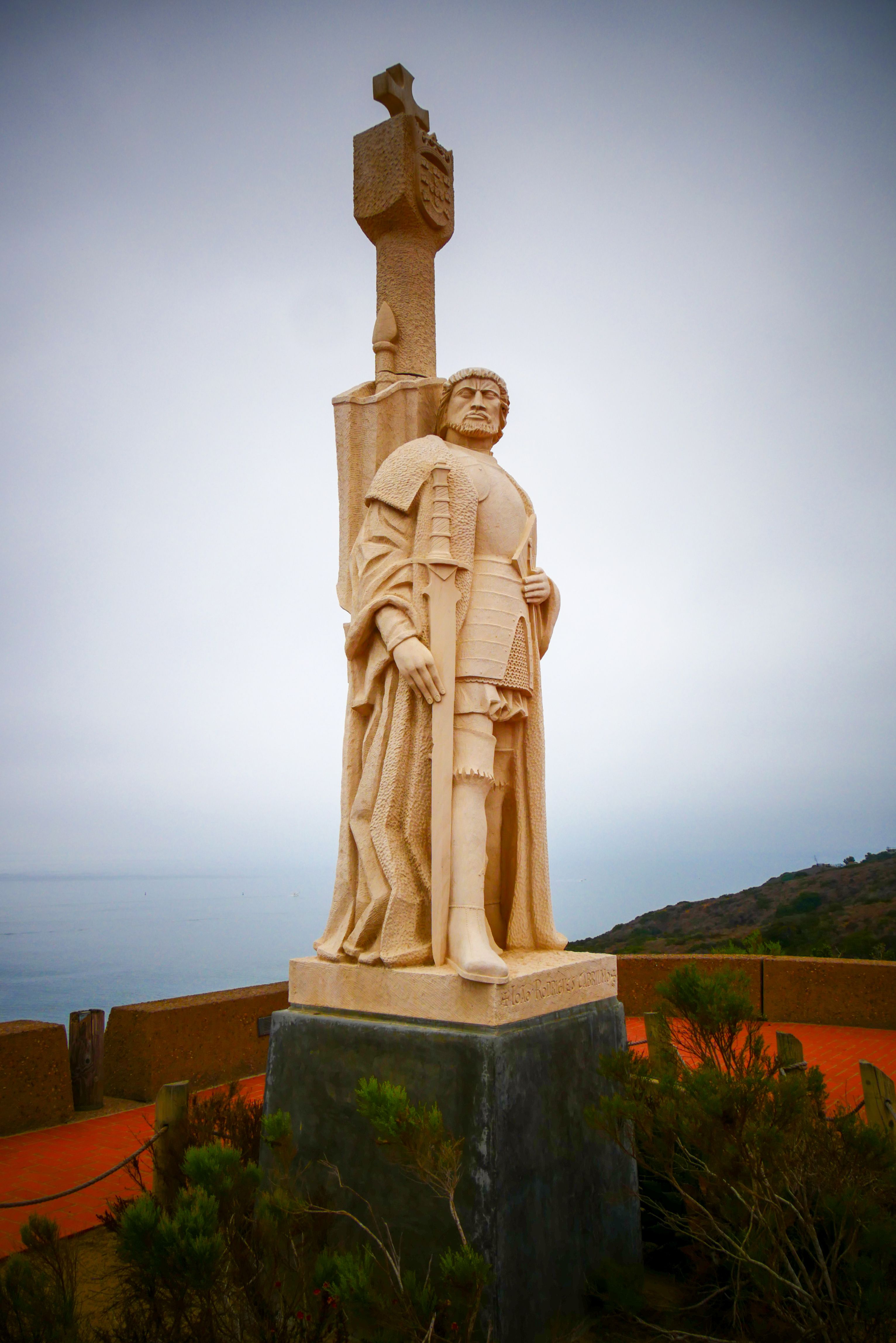Statue of Explorer in Scenic Coastal Landscape · Free Stock Photo