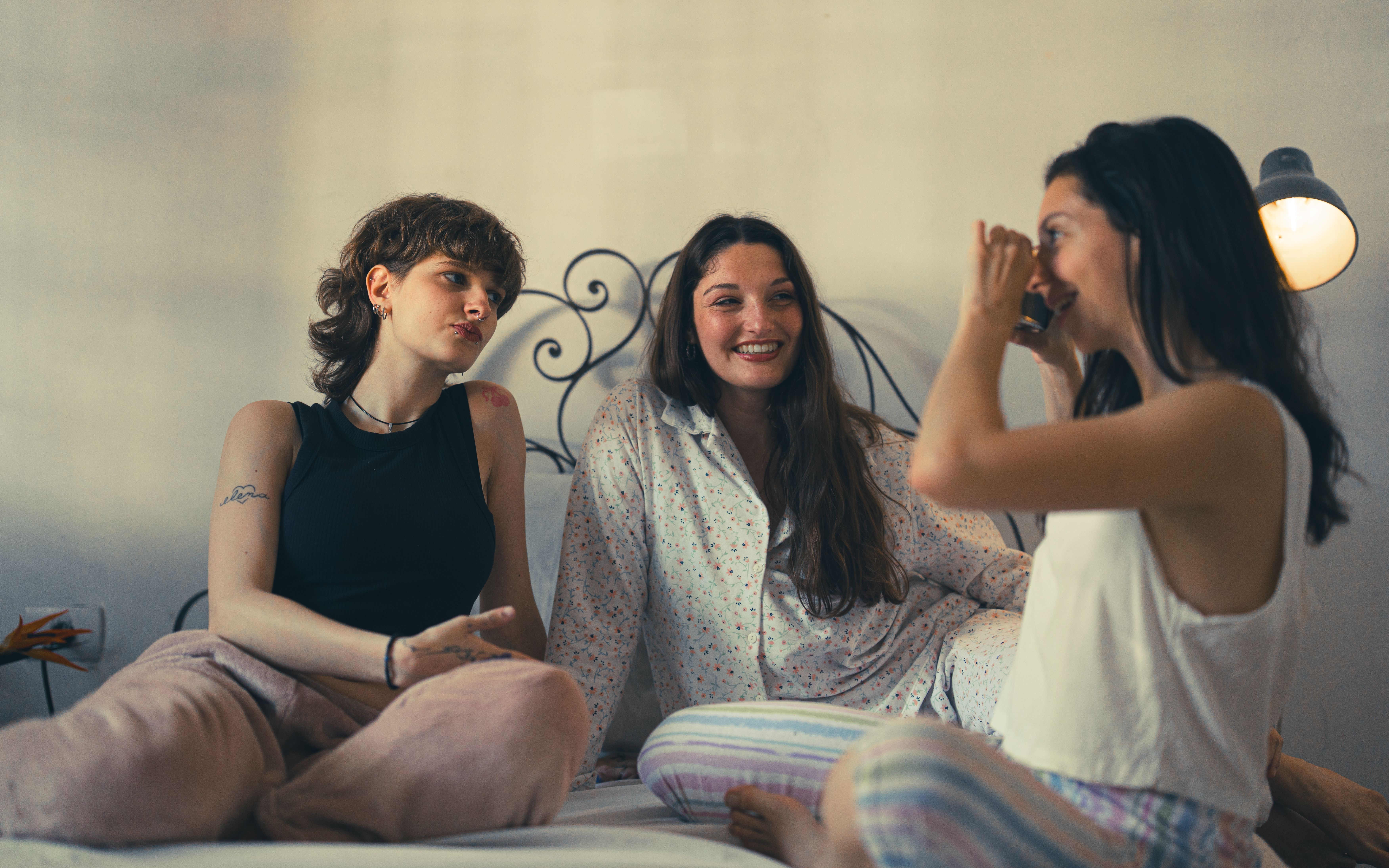 Young Women Having Fun at a Cozy Sleepover · Free Stock Photo