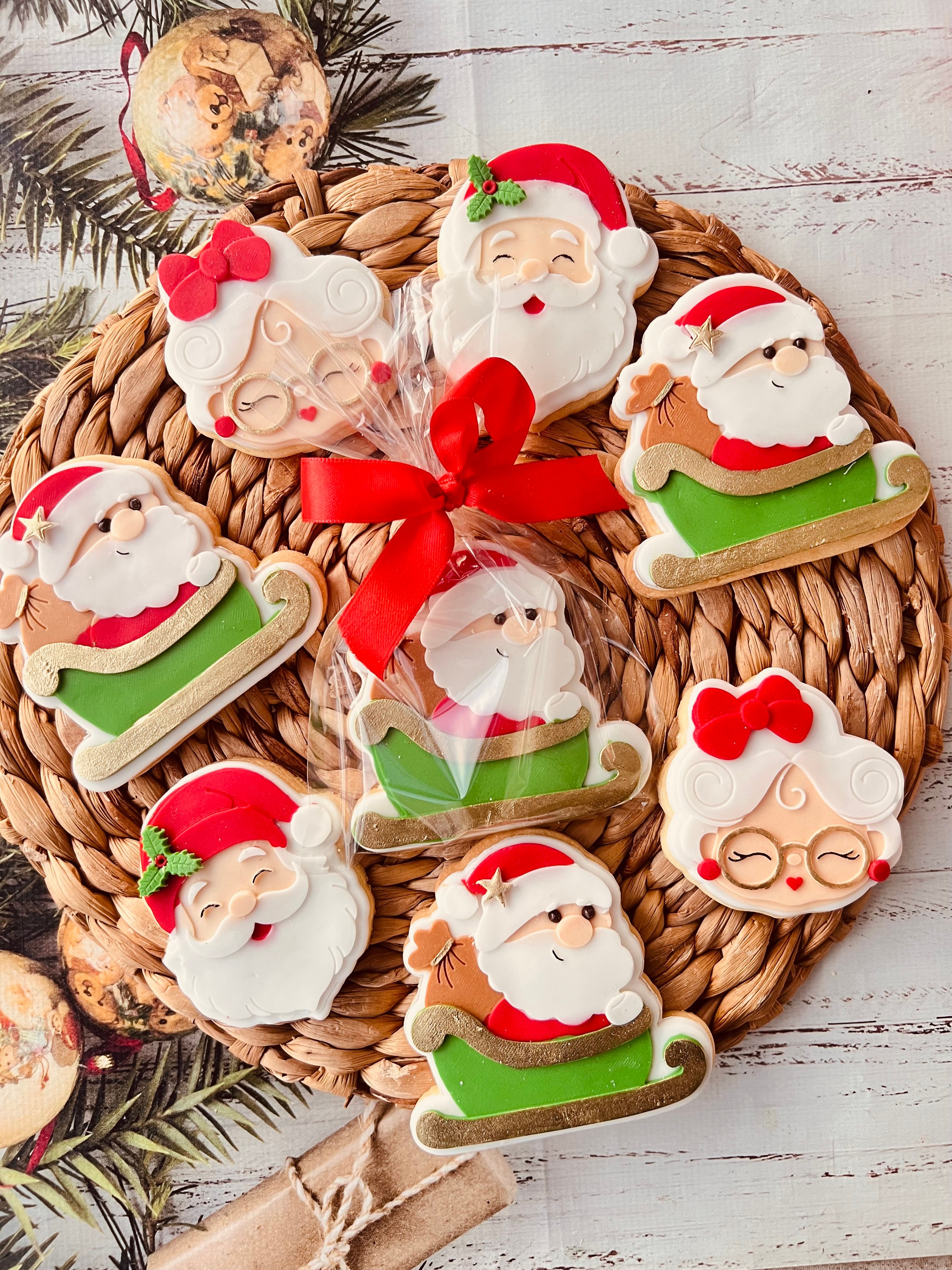 Festive Christmas Cookies Featuring Santa and Mrs. Claus · Free Stock Photo