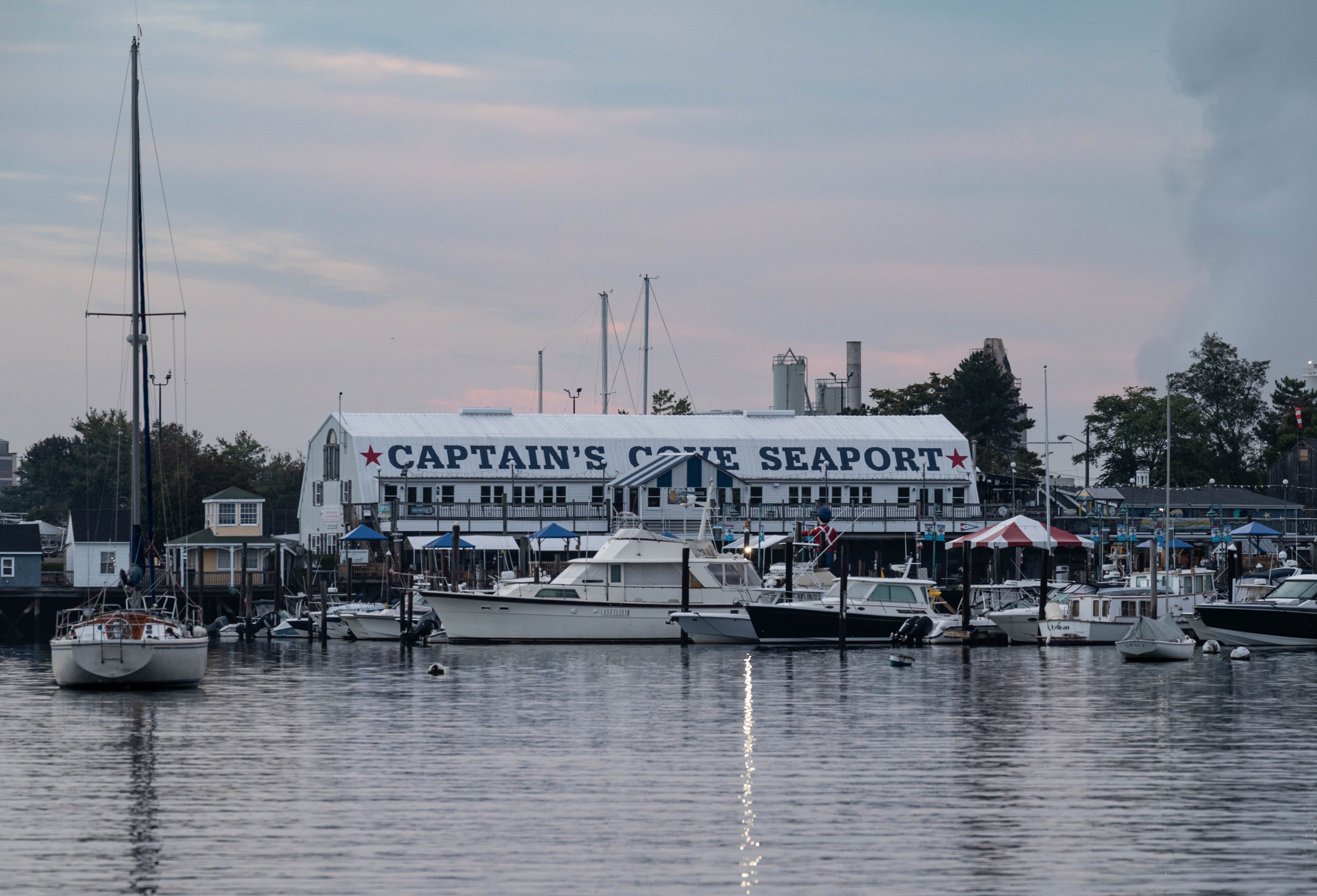 Captain's Cove Seaport at Sunset with Docked Boats · Free Stock Photo