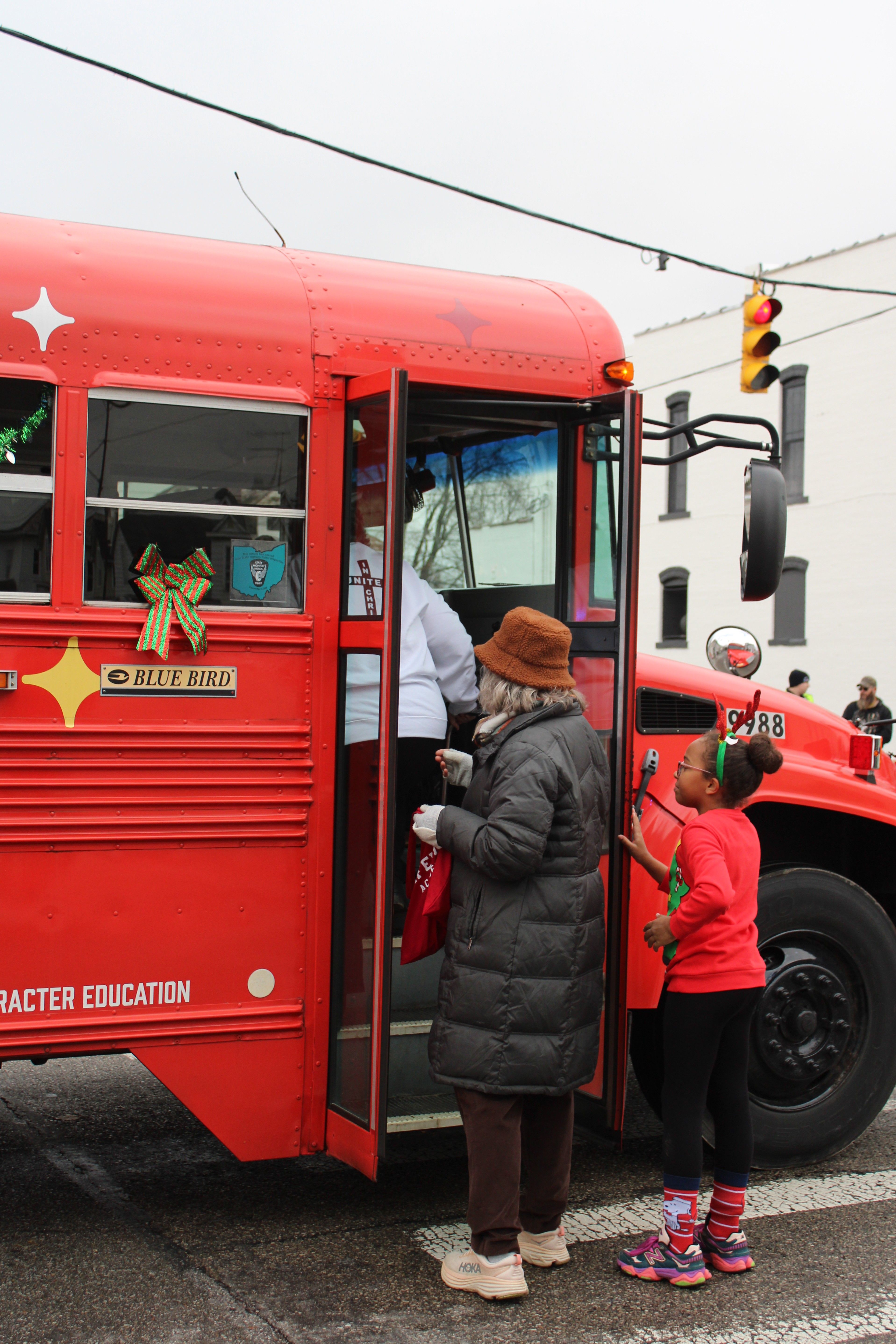 Festive Christmas Parade with Red Bus in Ohio · Free Stock Photo