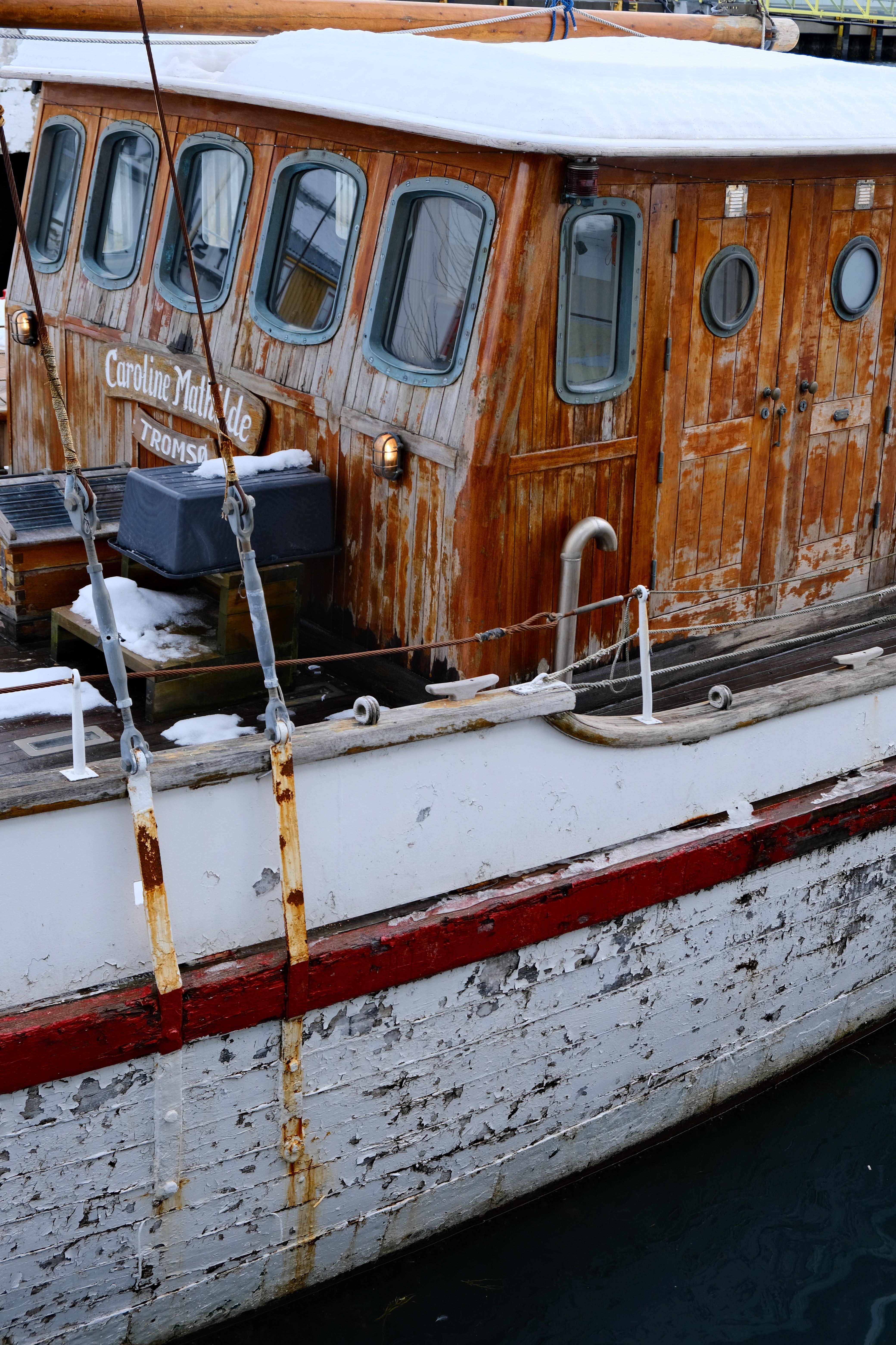 Rustic Wooden Boat Moored in Icy Harbor · Free Stock Photo