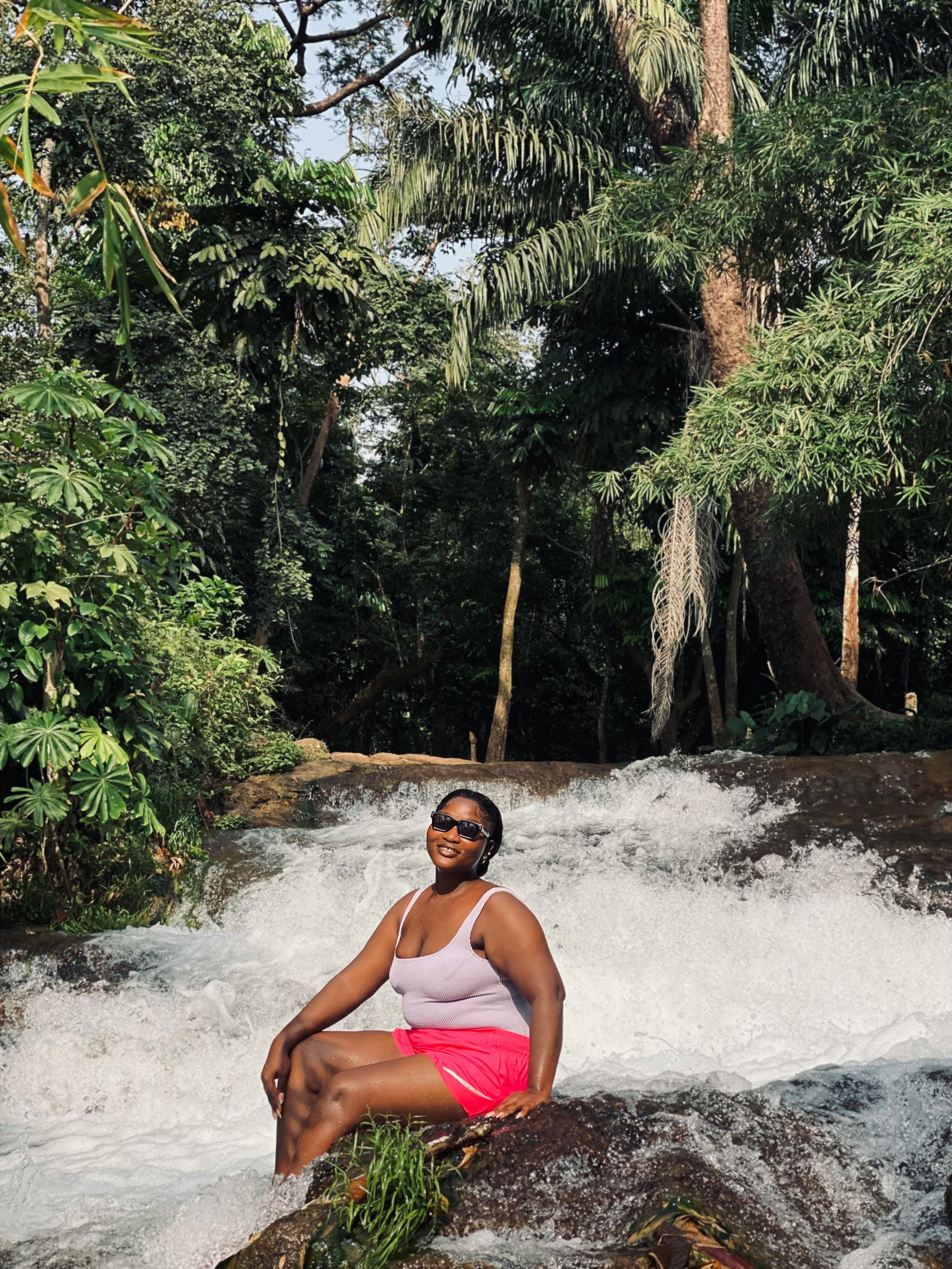 Woman Enjoying Ezeagu Waterfall's Natural Beauty · Free Stock Photo