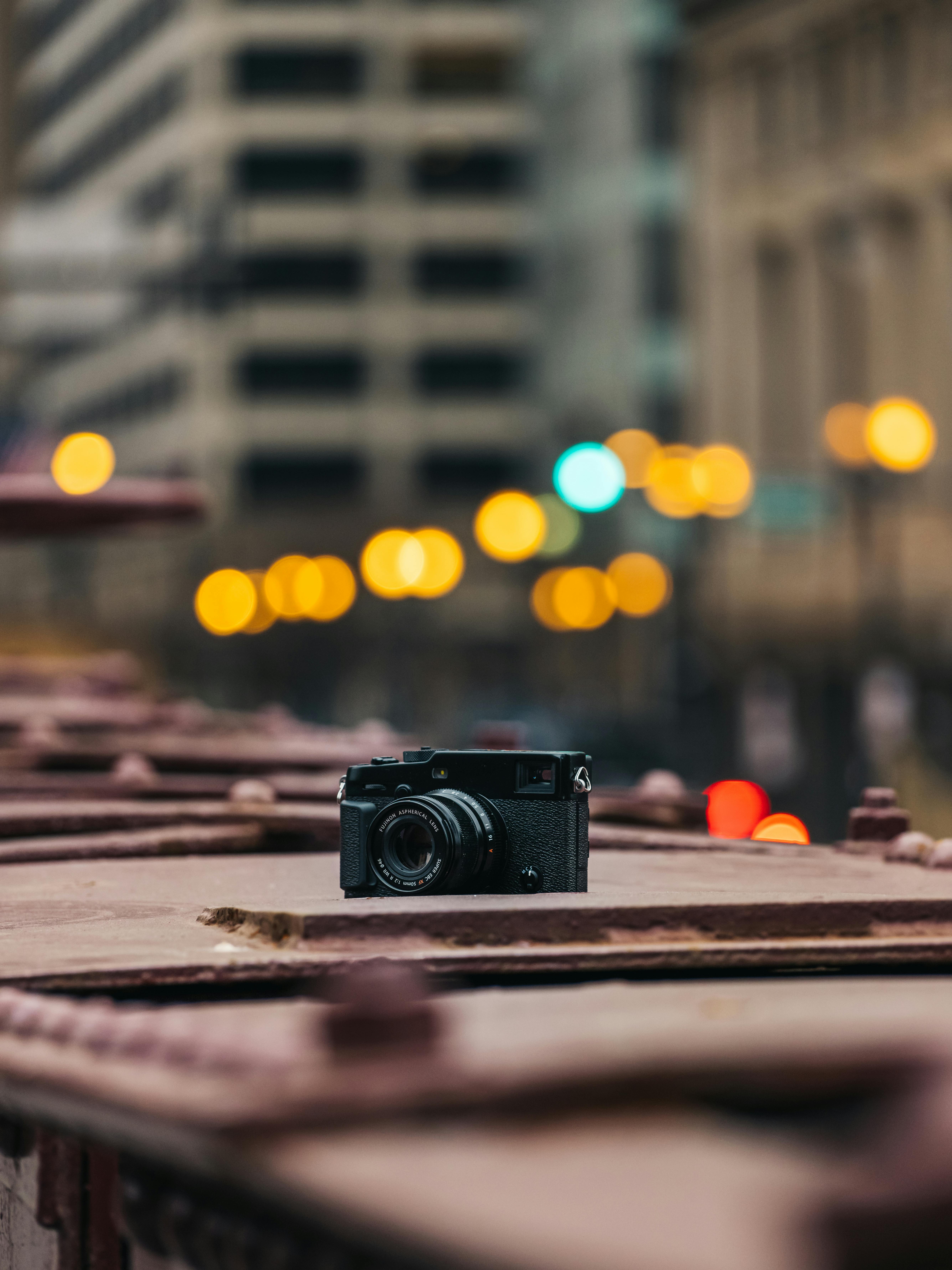 Gray Scale Photo of Man Holding Analog Camera · Free Stock Photo