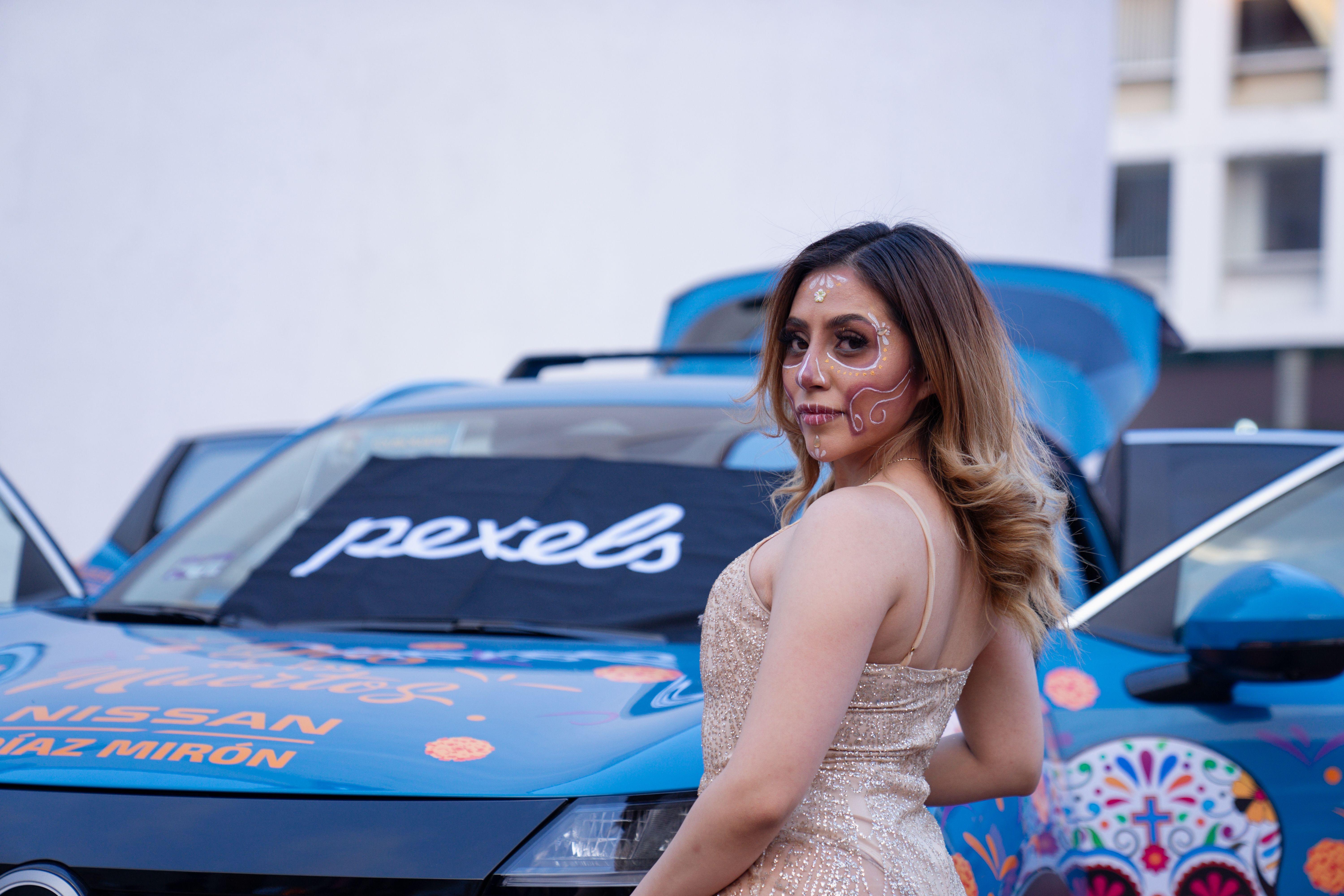 Festive Makeup with Colorful Car Art Backdrop · Free Stock Photo