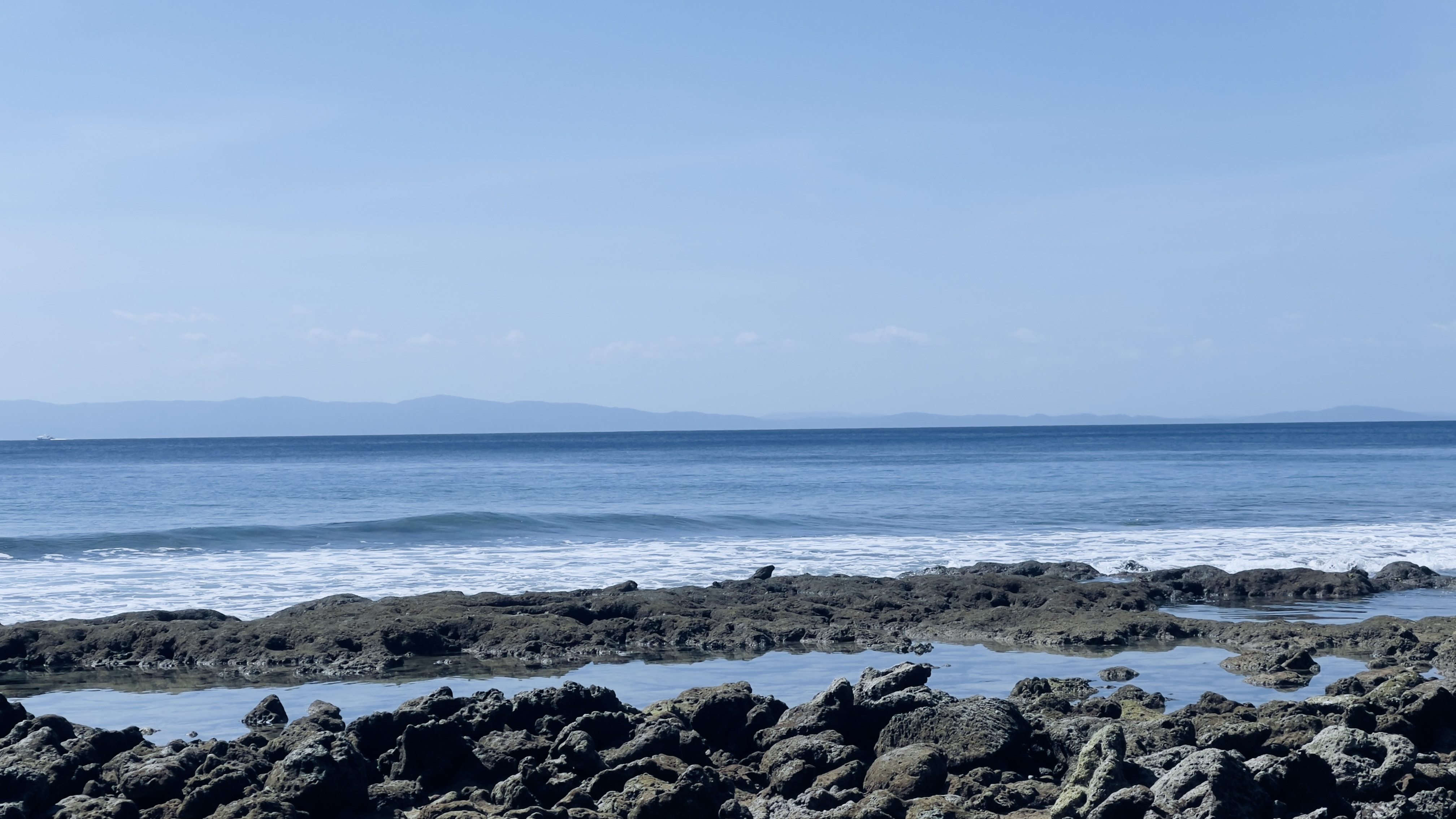 Rocky Shoreline with Serene Ocean View · Free Stock Photo