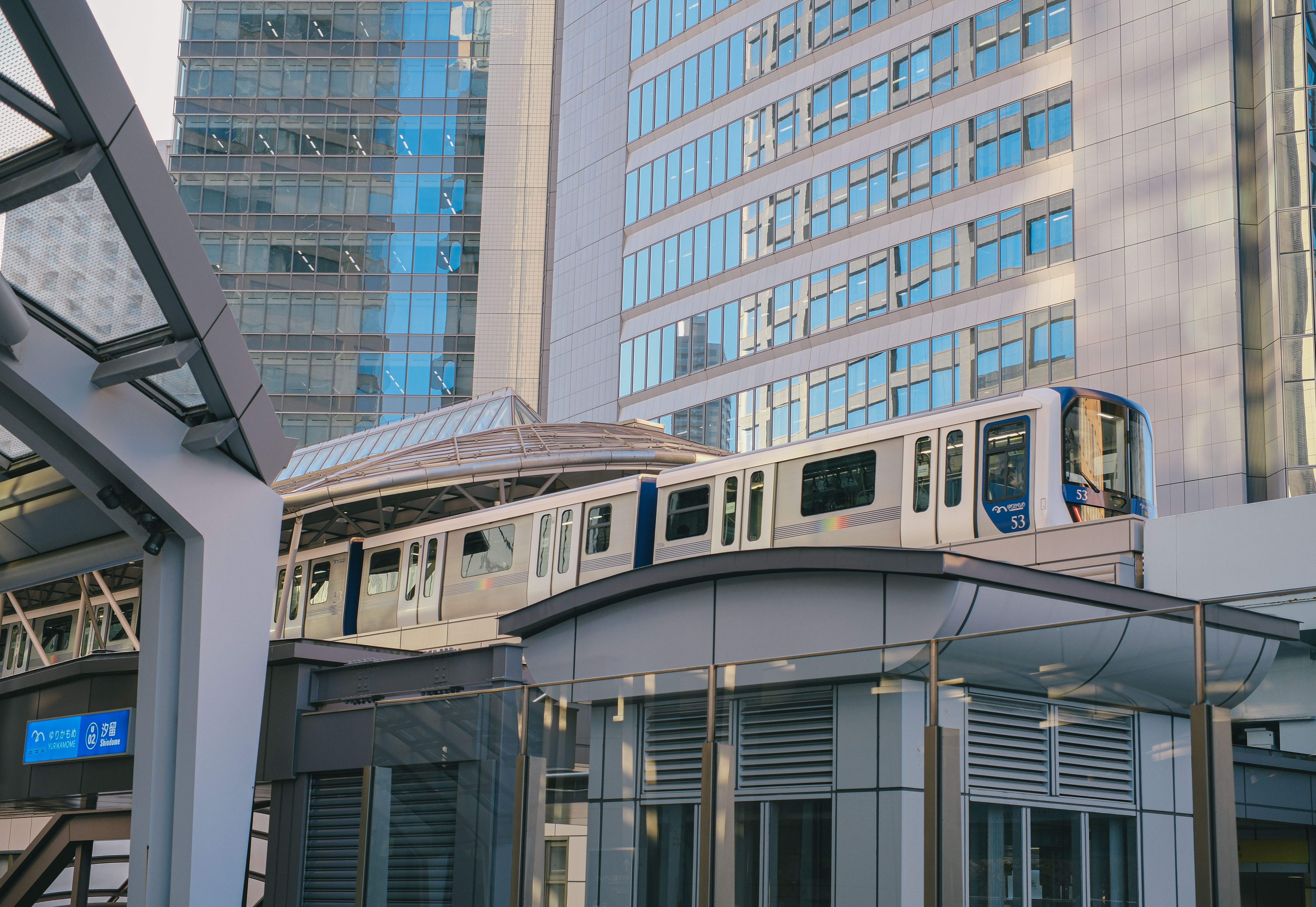 Modern Cityscape with Elevated Train · Free Stock Photo