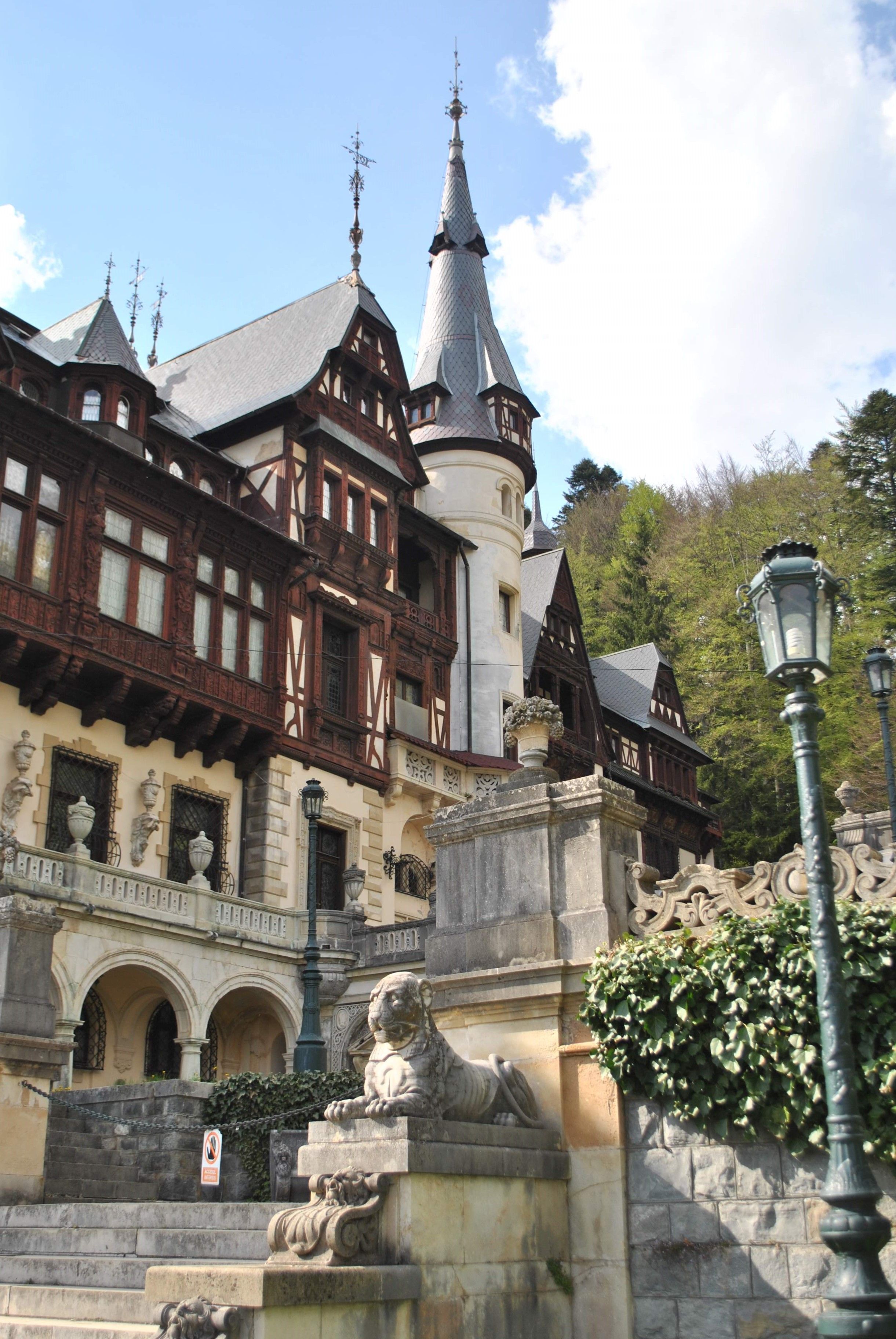 Gothic Revival Castle with Tower and Sculpture · Free Stock Photo