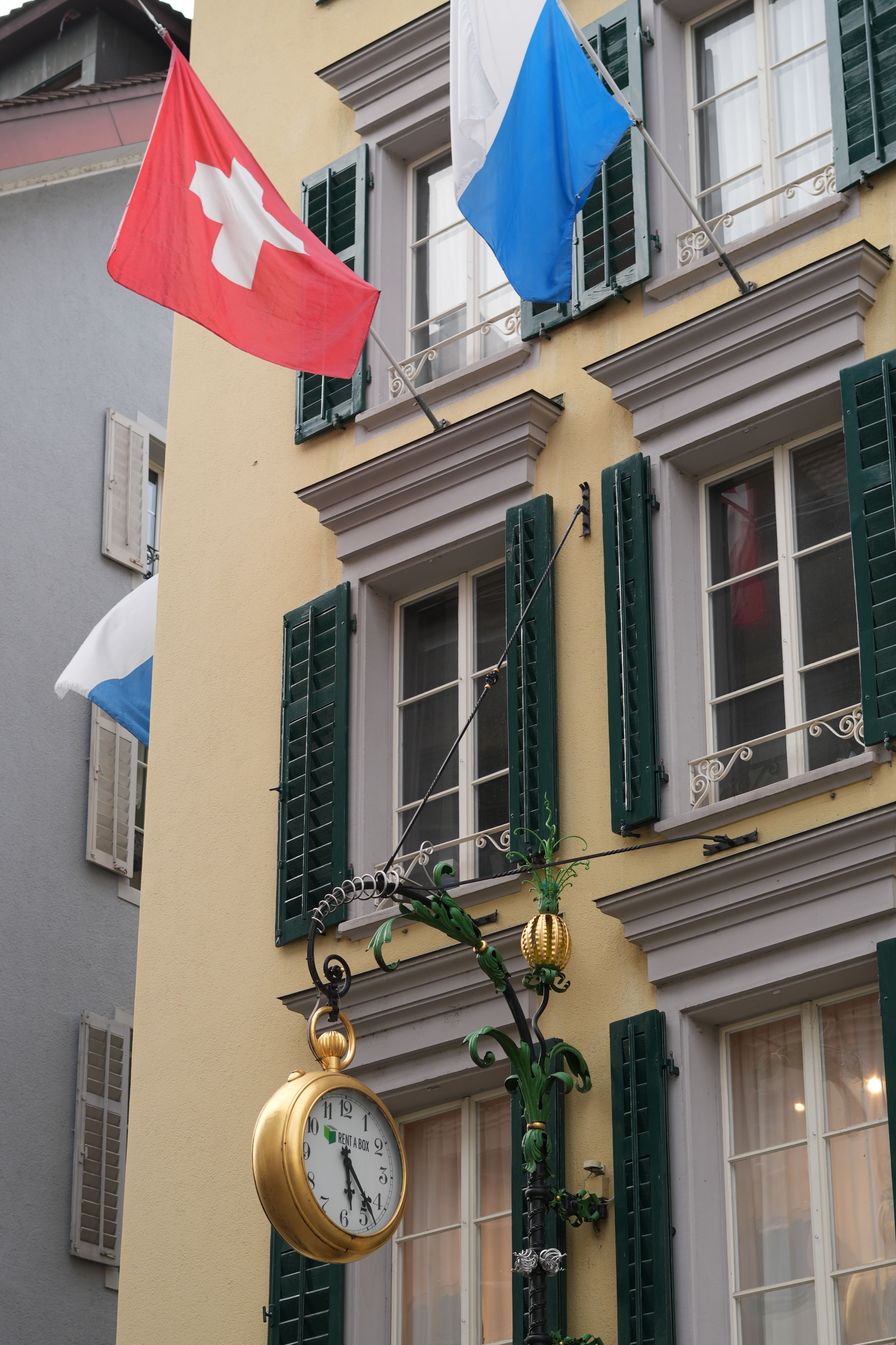 Swiss Building Facade with Old Clock in Luzern · Free Stock Photo